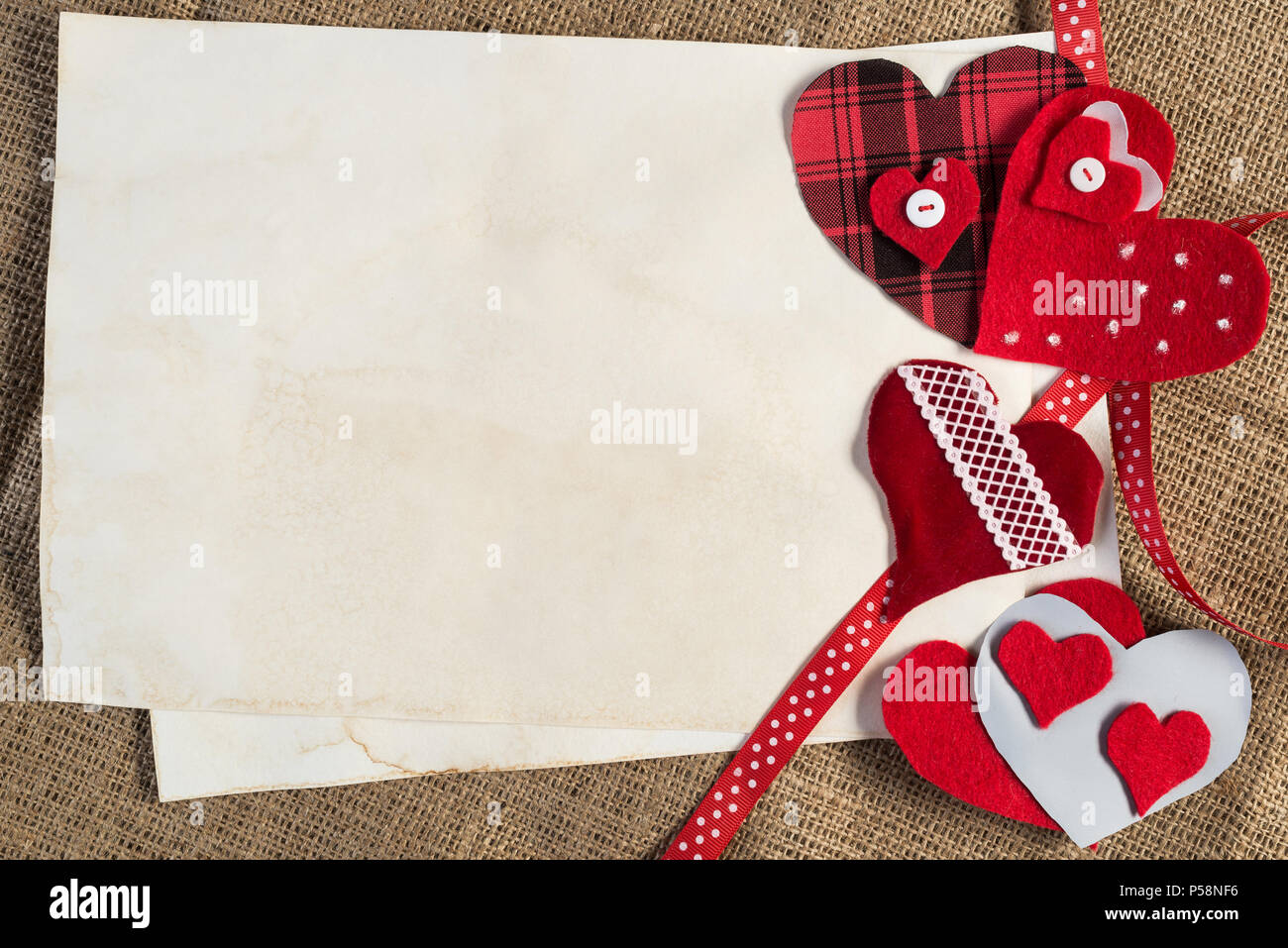 Handmade love hearts and sheets of blank paper Stock Photo - Alamy