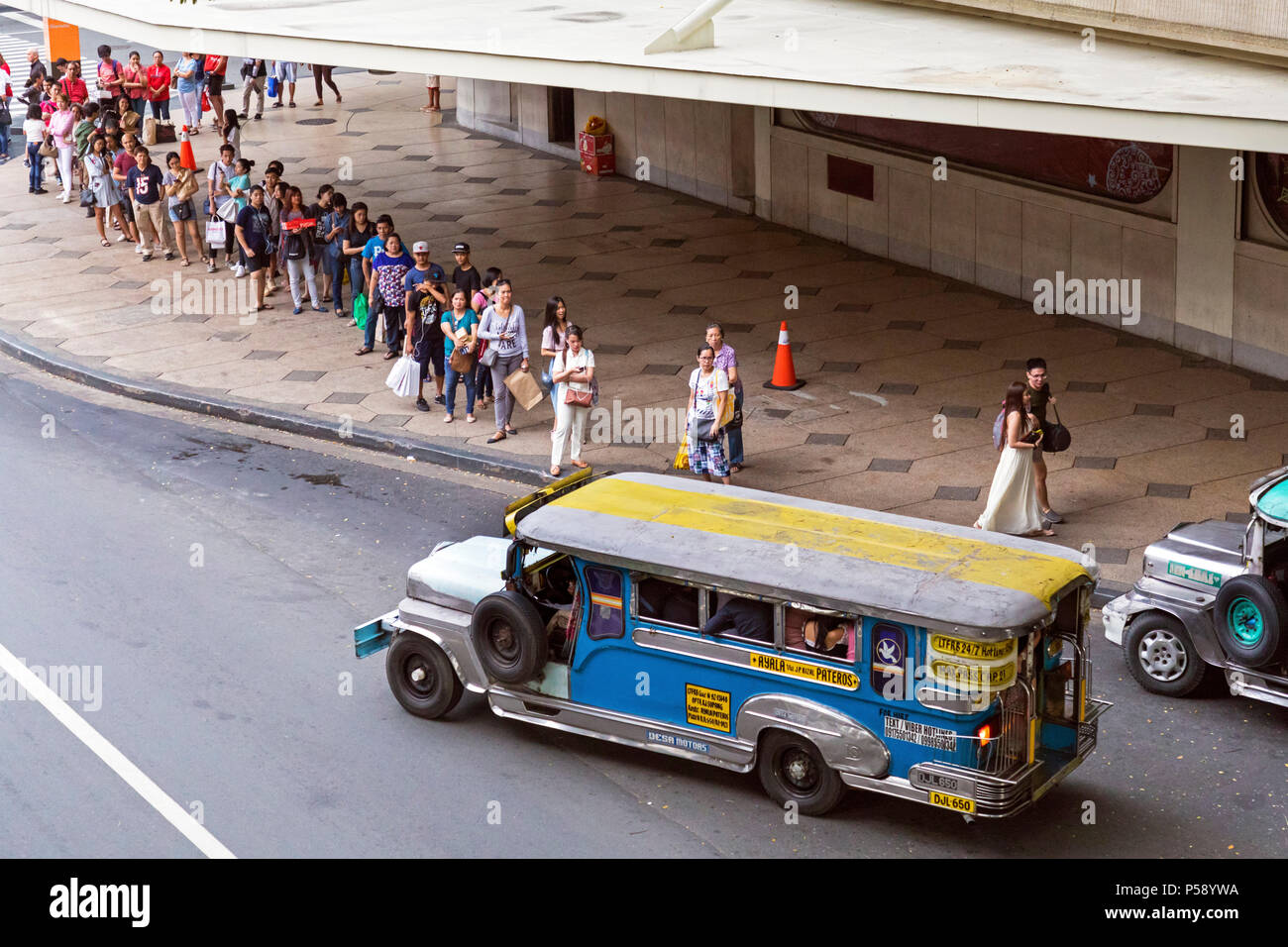 Queue of people waiting for jeepney, Ayala Centre, Greenbelt, Manila ...