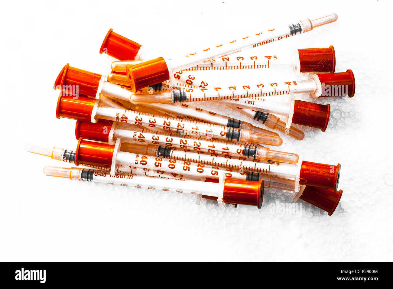 Close up of a bunch of unused syringes isolated on white Stock Photo ...