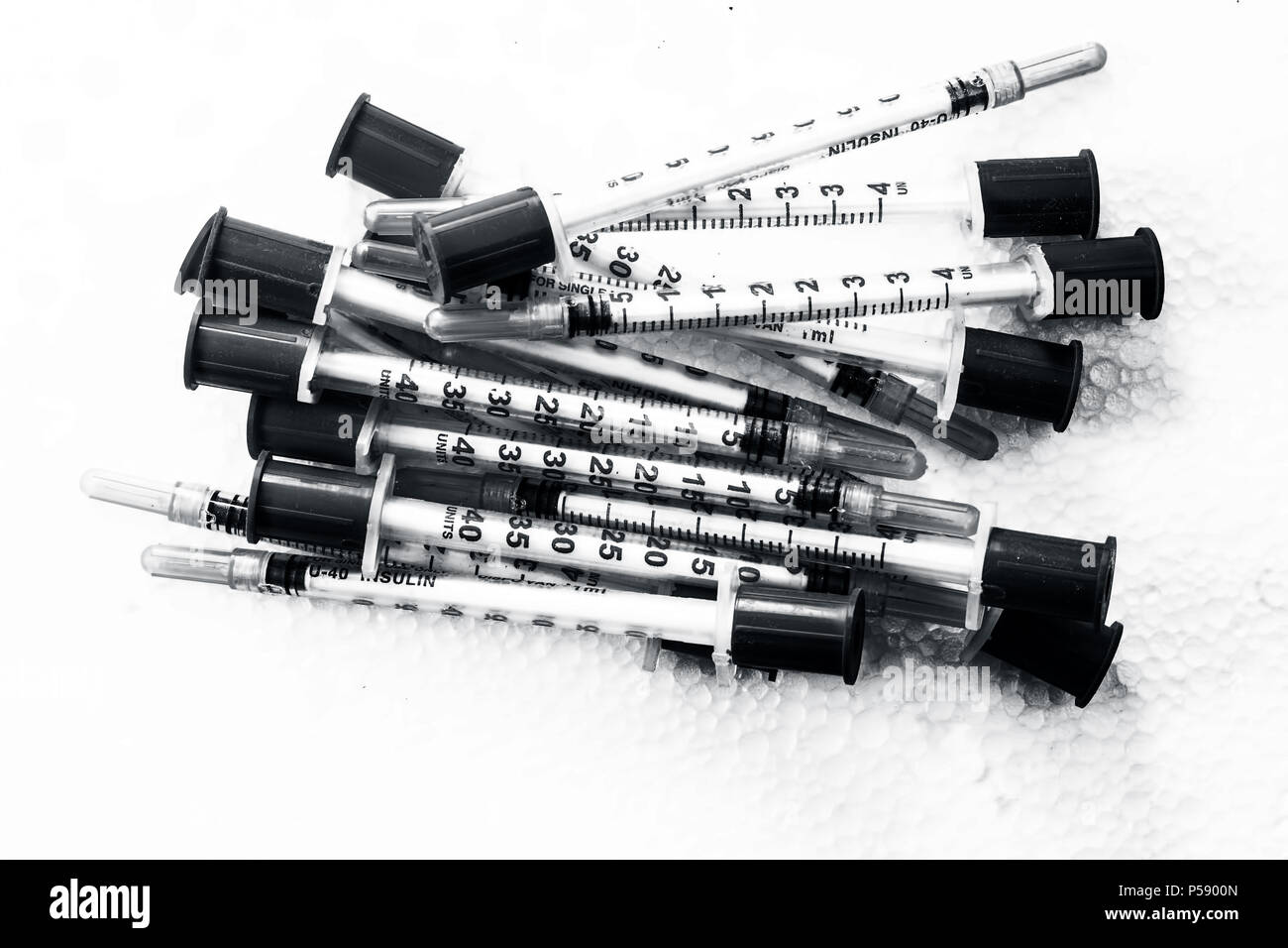 Close up of a bunch of unused syringes isolated on white Stock Photo ...