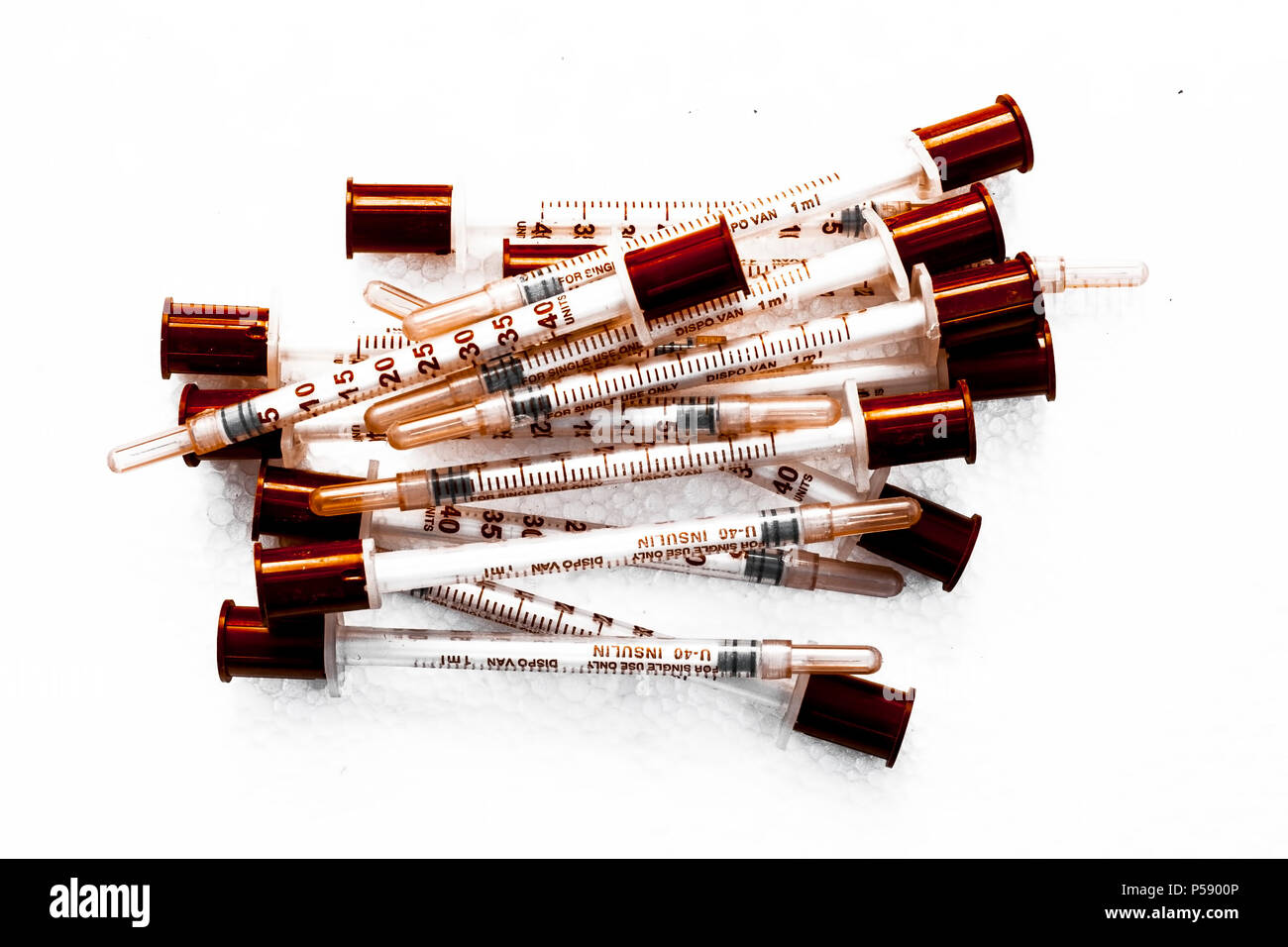 Close up of a bunch of unused syringes isolated on white Stock Photo ...