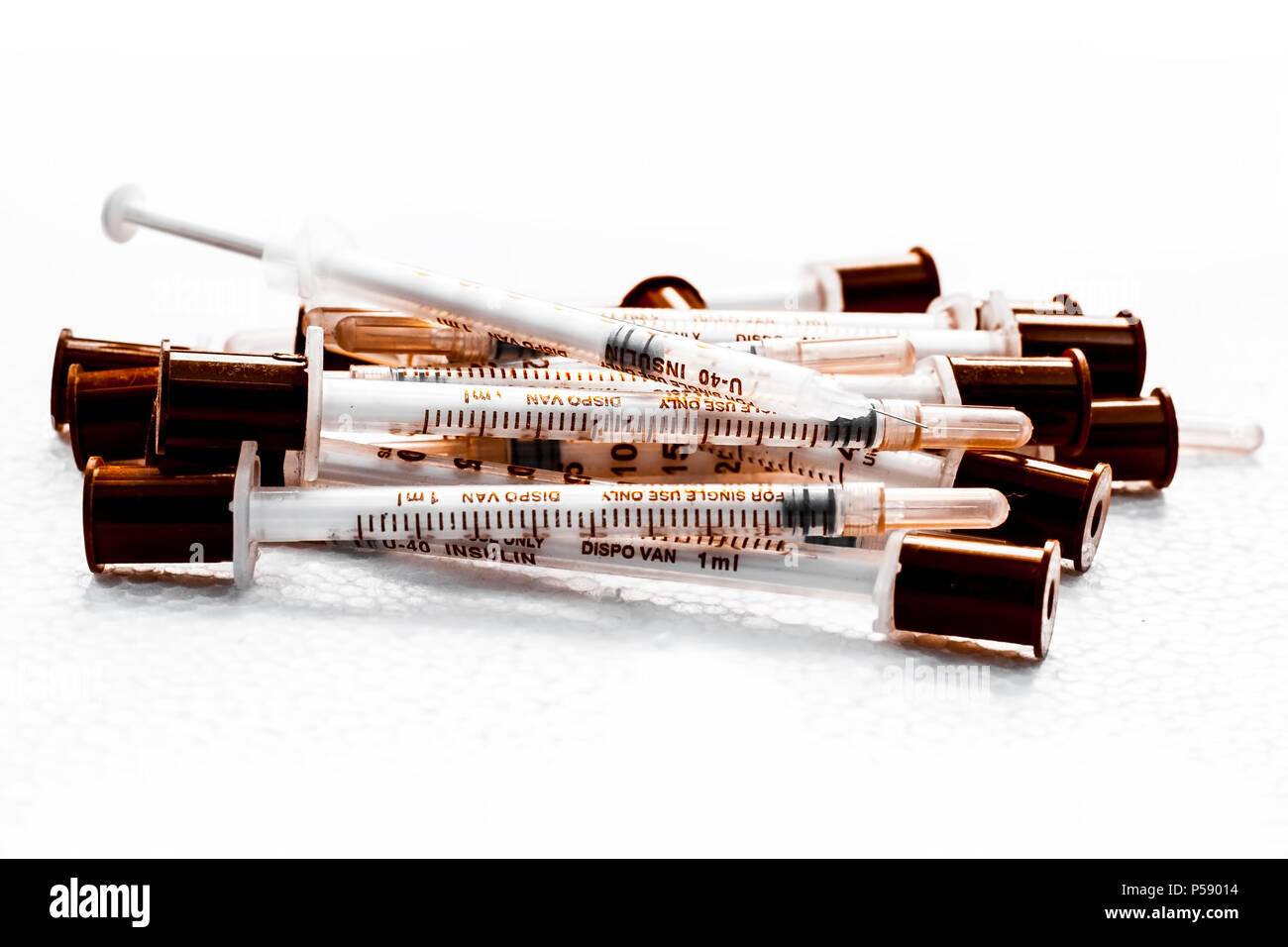 Close up of a bunch of unused syringes isolated on white Stock Photo ...