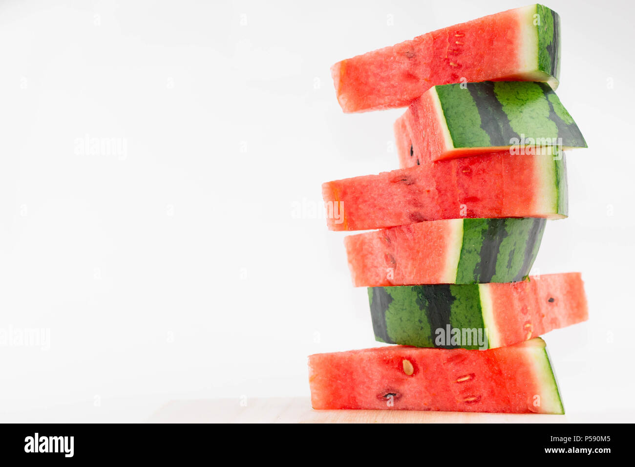stacked watermelon slices isolated Stock Photo - Alamy