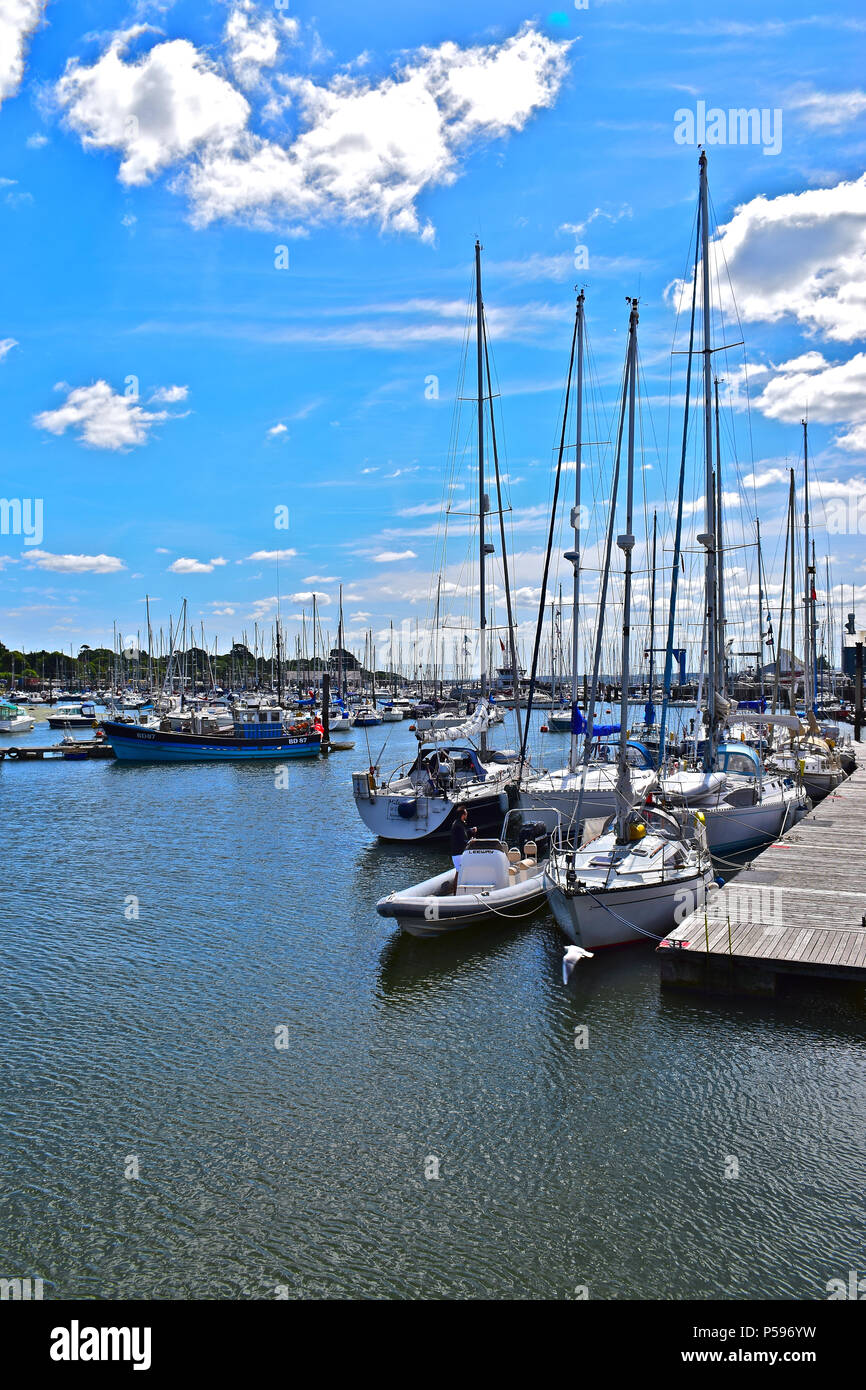 A quiet & peaceful harbour-side view of sailing boats moored alongside ...