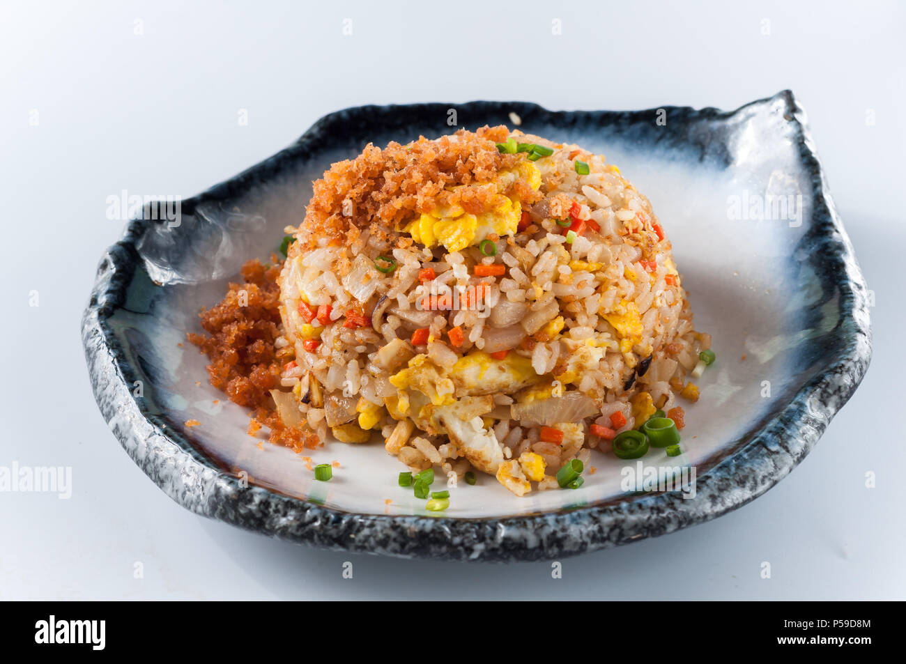 chinese cuisine, salt salmon fish and egg fried rice on white ...