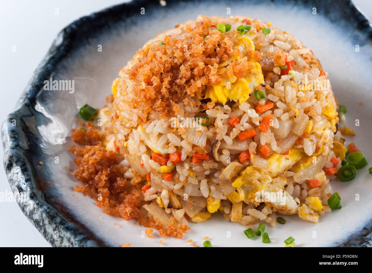 chinese cuisine, salt salmon fish and egg fried rice on white ...