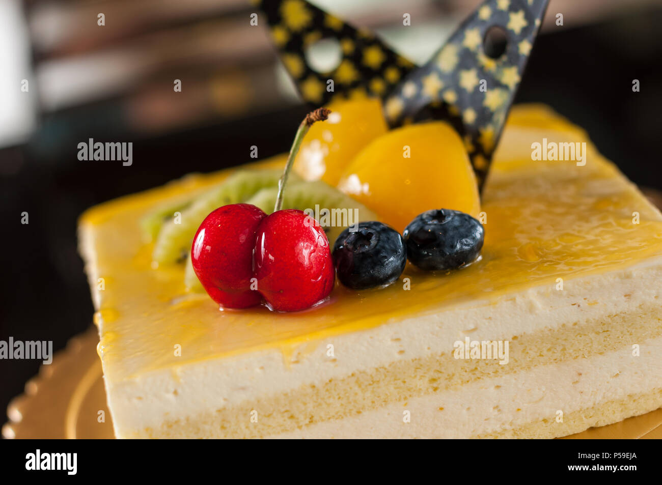 Mango Mousse Cake with fruit Stock Photo - Alamy