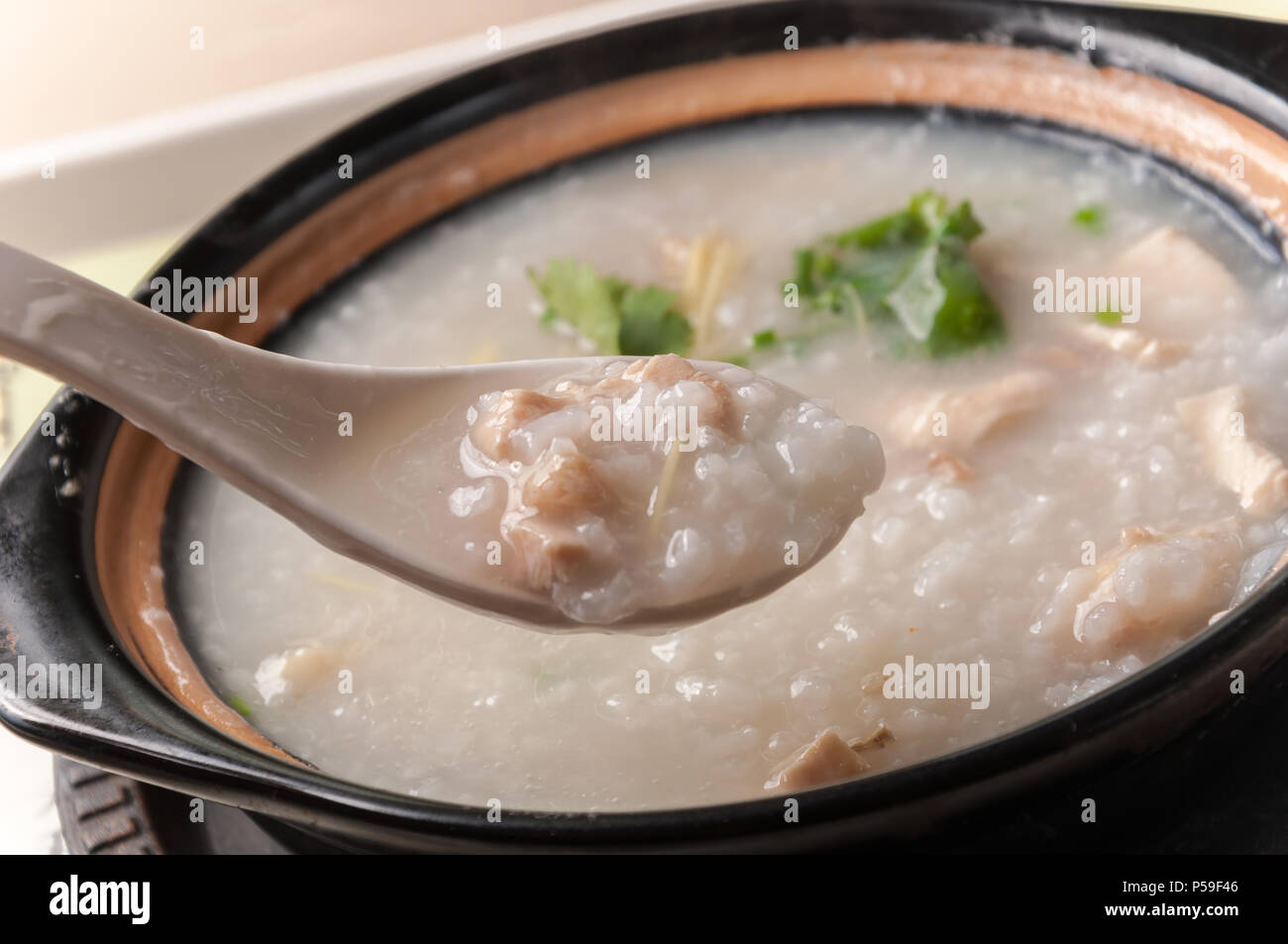 Porridge, abalone & chicken Porridge (congee) served in claypot Stock ...