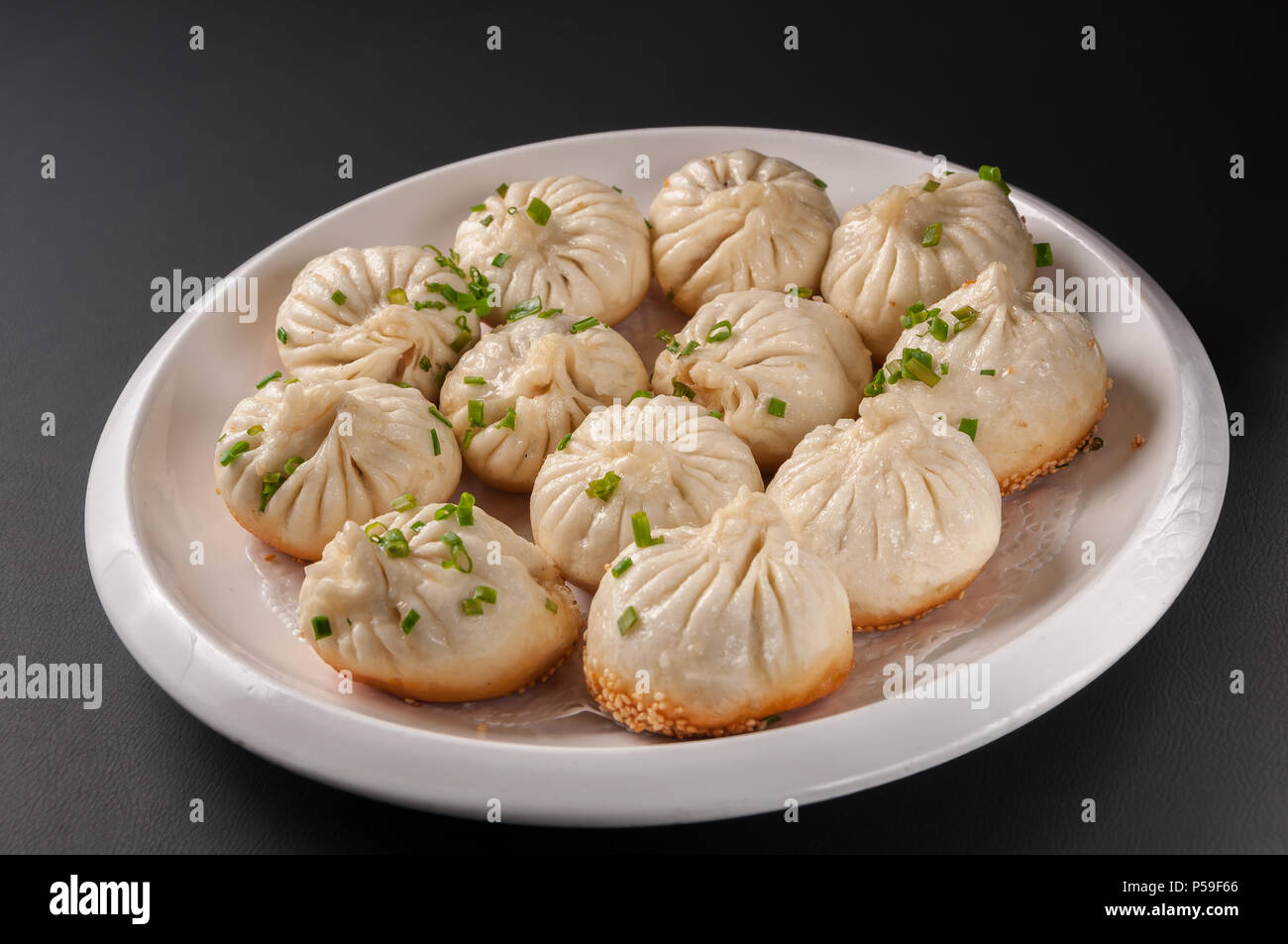 Shanghai Pan-Fried Baozi Stuffed with Pork Stock Photo - Alamy