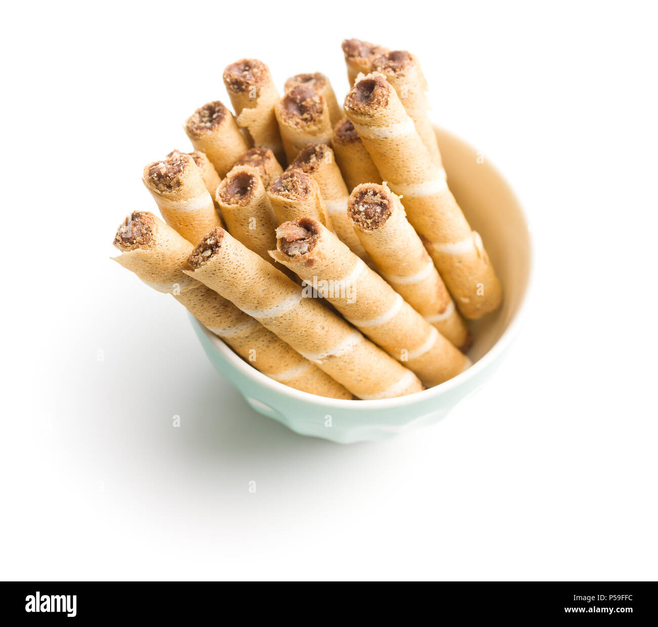 Sweet chocolate waffle rolls in bowl isolated on white background Stock ...