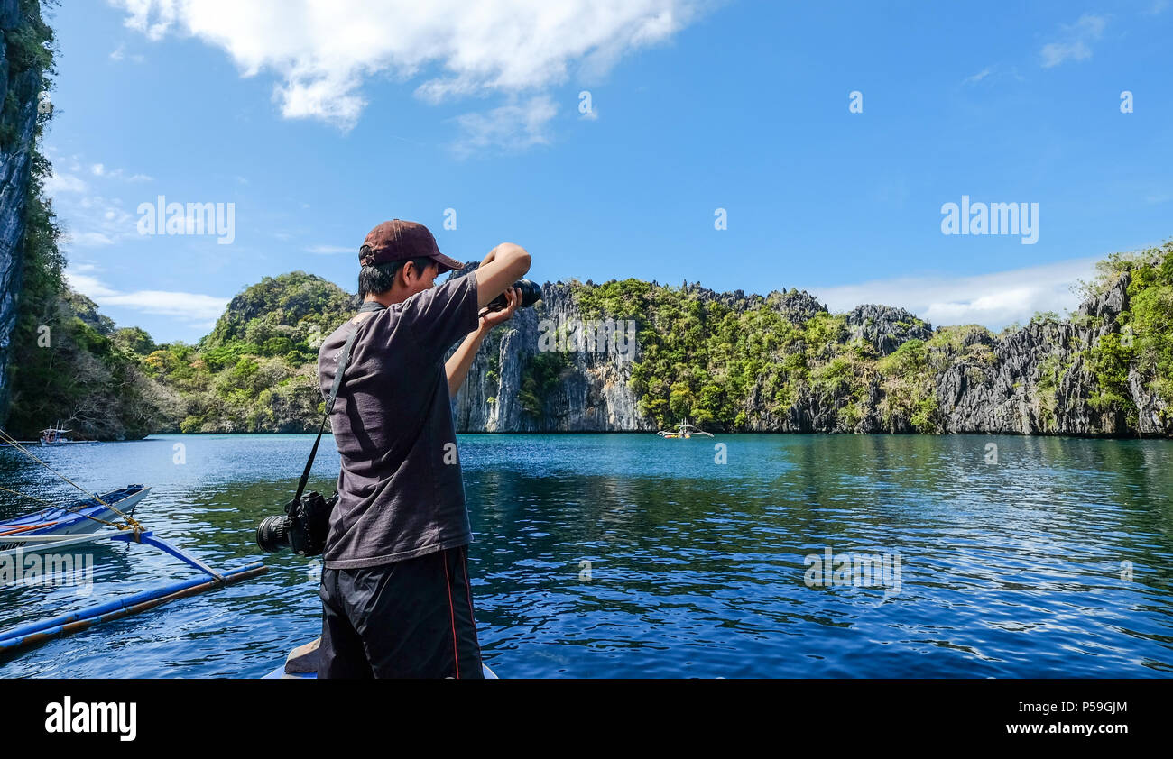Palawan, Philippines - Apr 5, 2017. A traveler standing on tourist boat ...