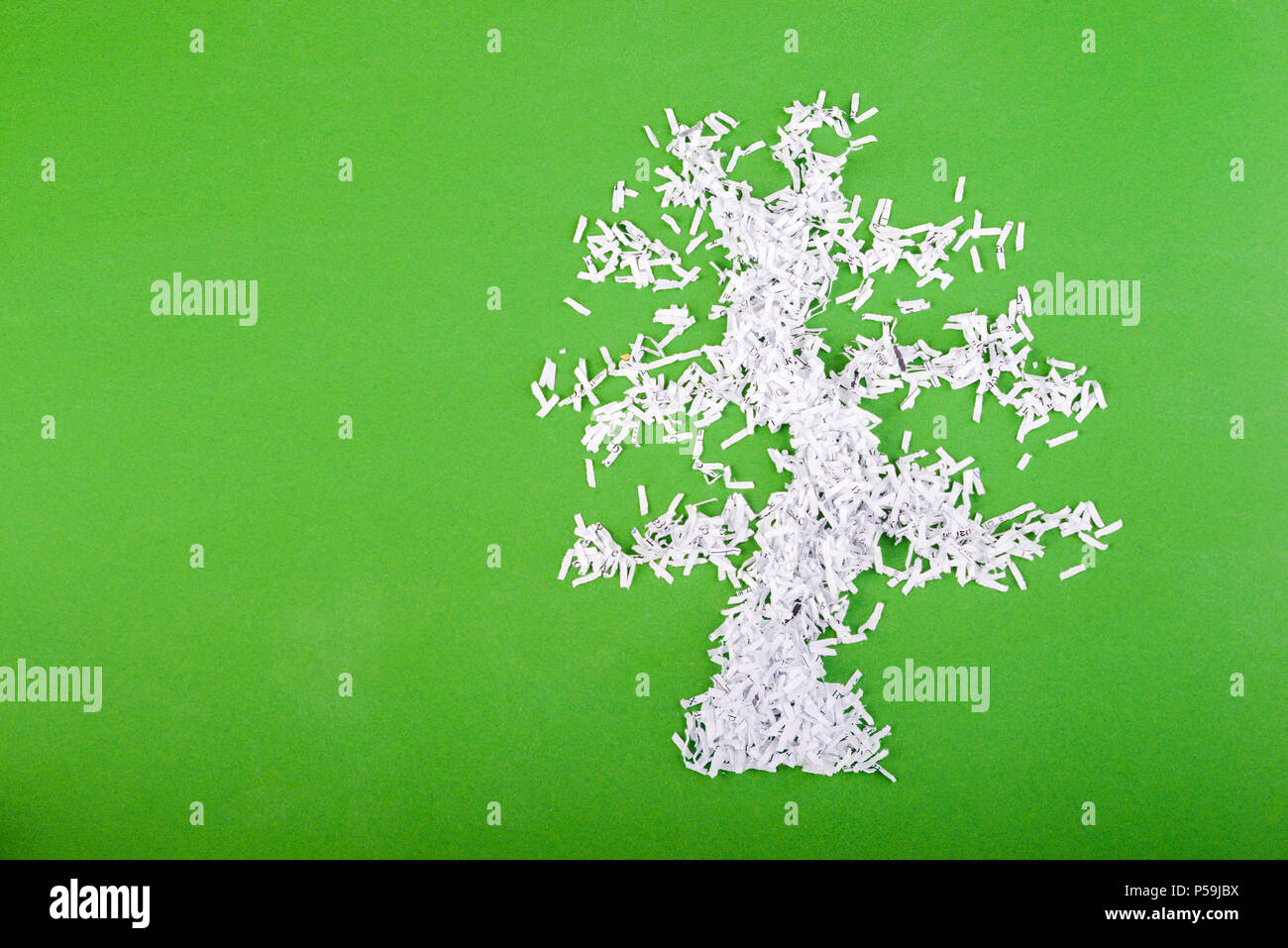 simple green tree symbol made from shredded paper particles on green ...