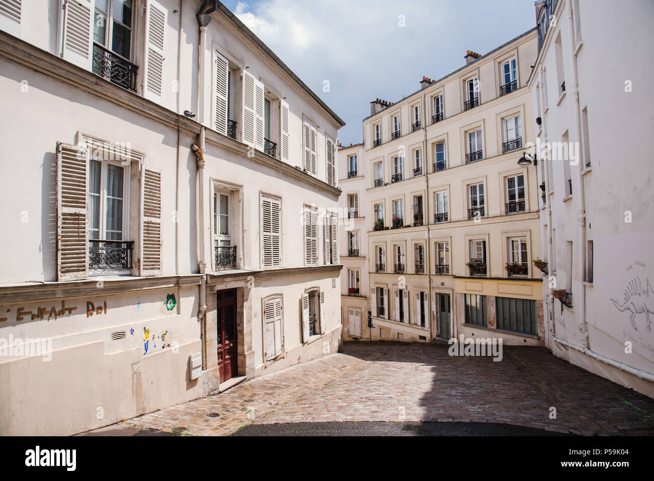 Paris, France - August 10, 2017. Cobbled street in Montmartre with old ...