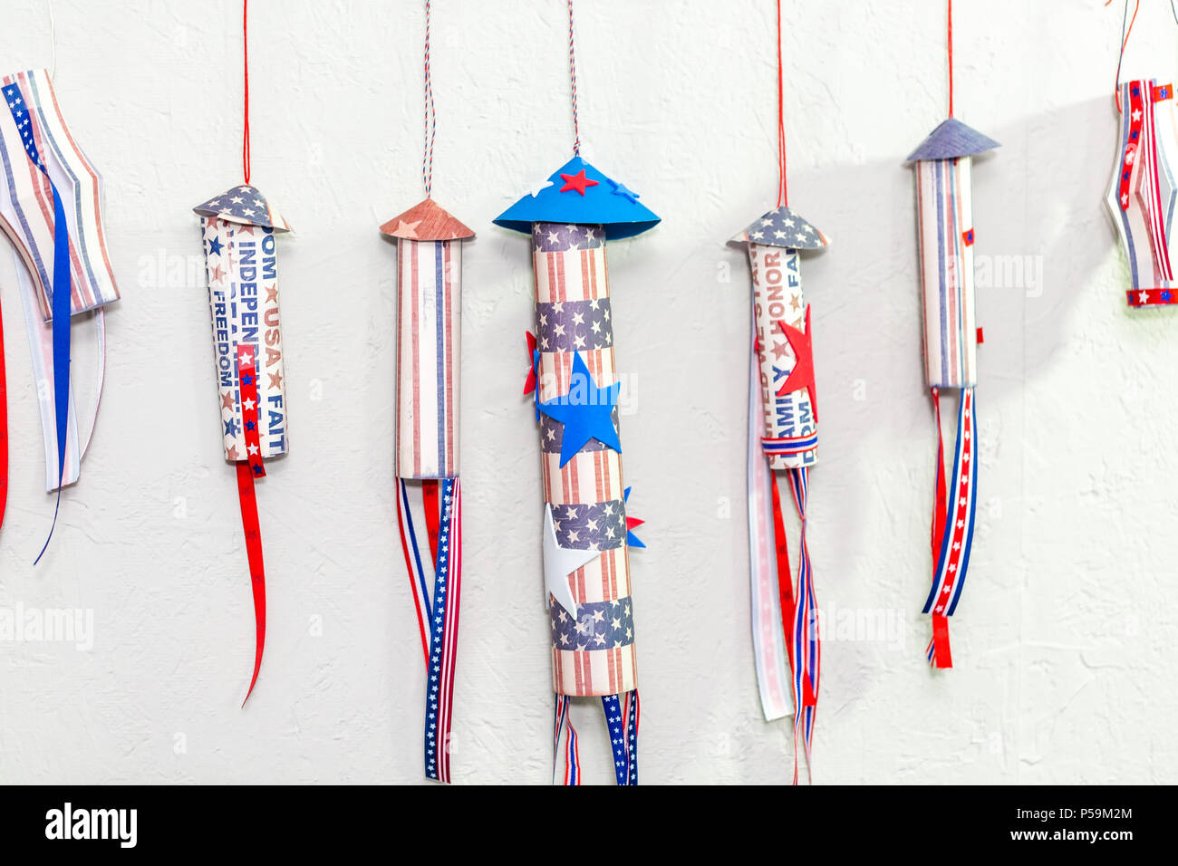 Paper firecrackers made from red, white and blue paper for July 4th ...