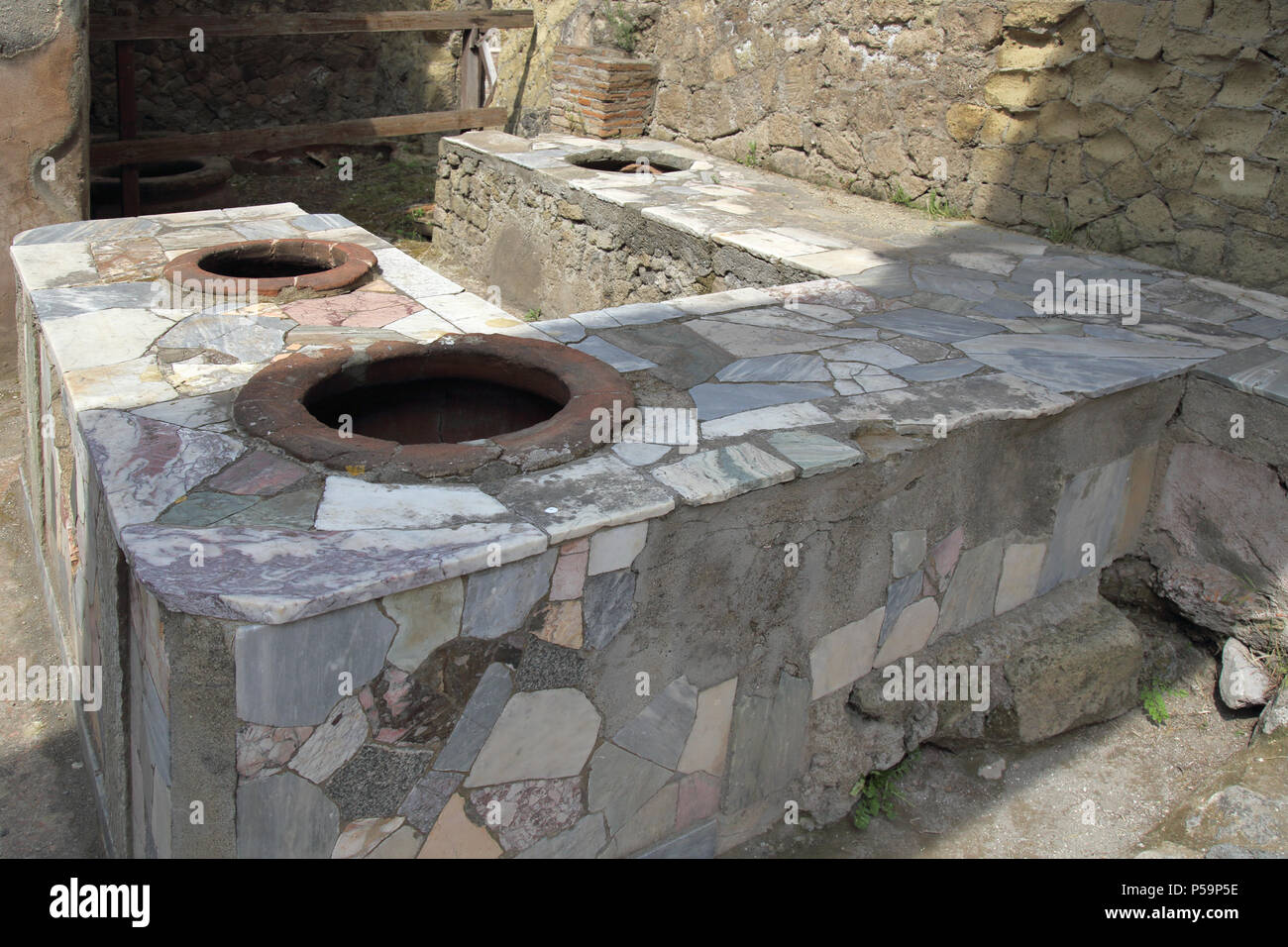 pots for selling food in the partly uncovered roman city of Herculaneum ...