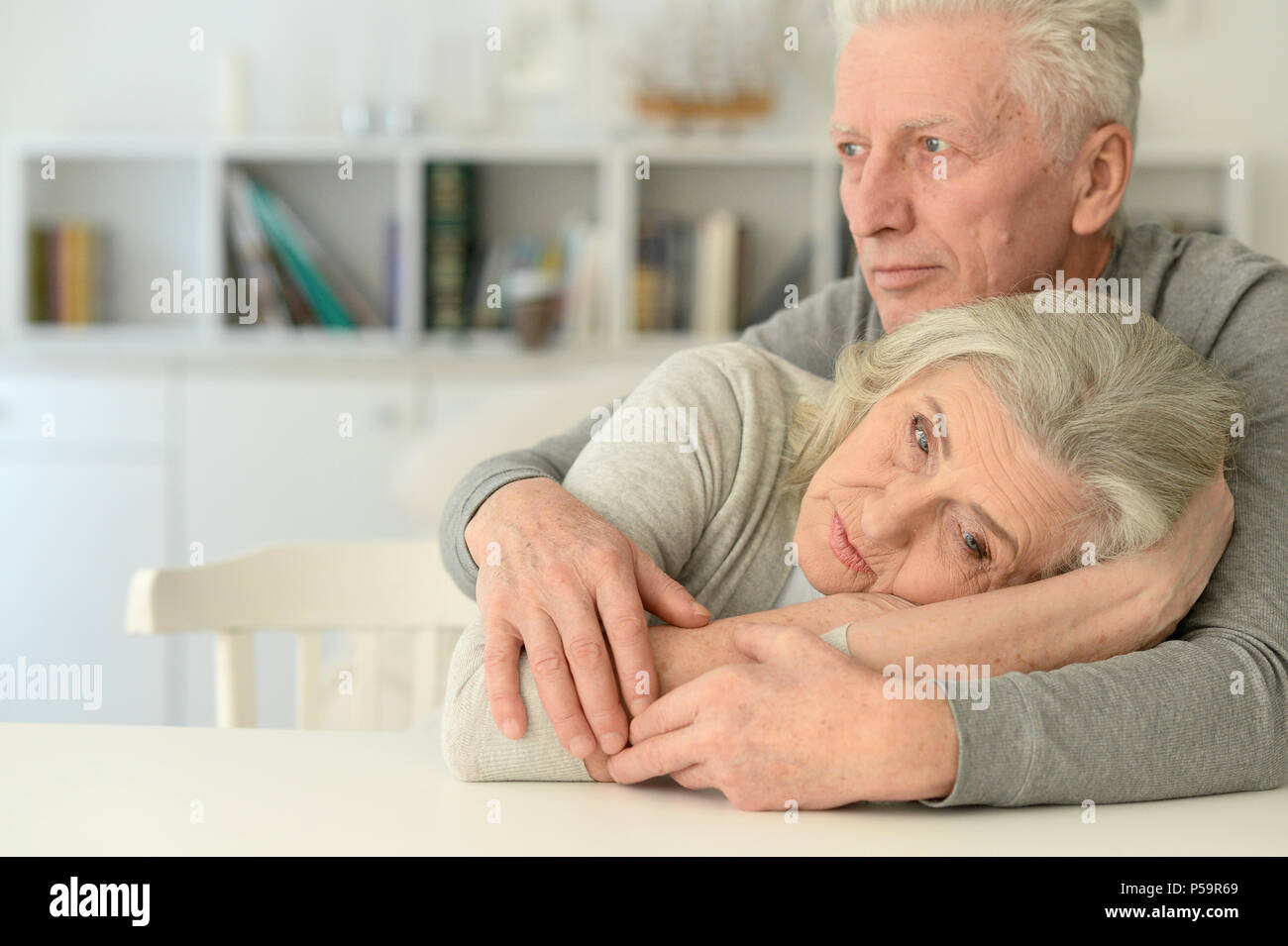 portrait beautiful Sad Senior couple posing at home Stock Photo - Alamy
