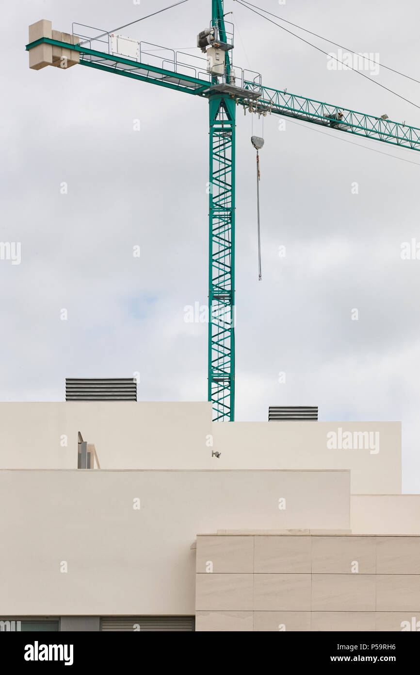 Modern building and crane machinery structure. Construction industry ...