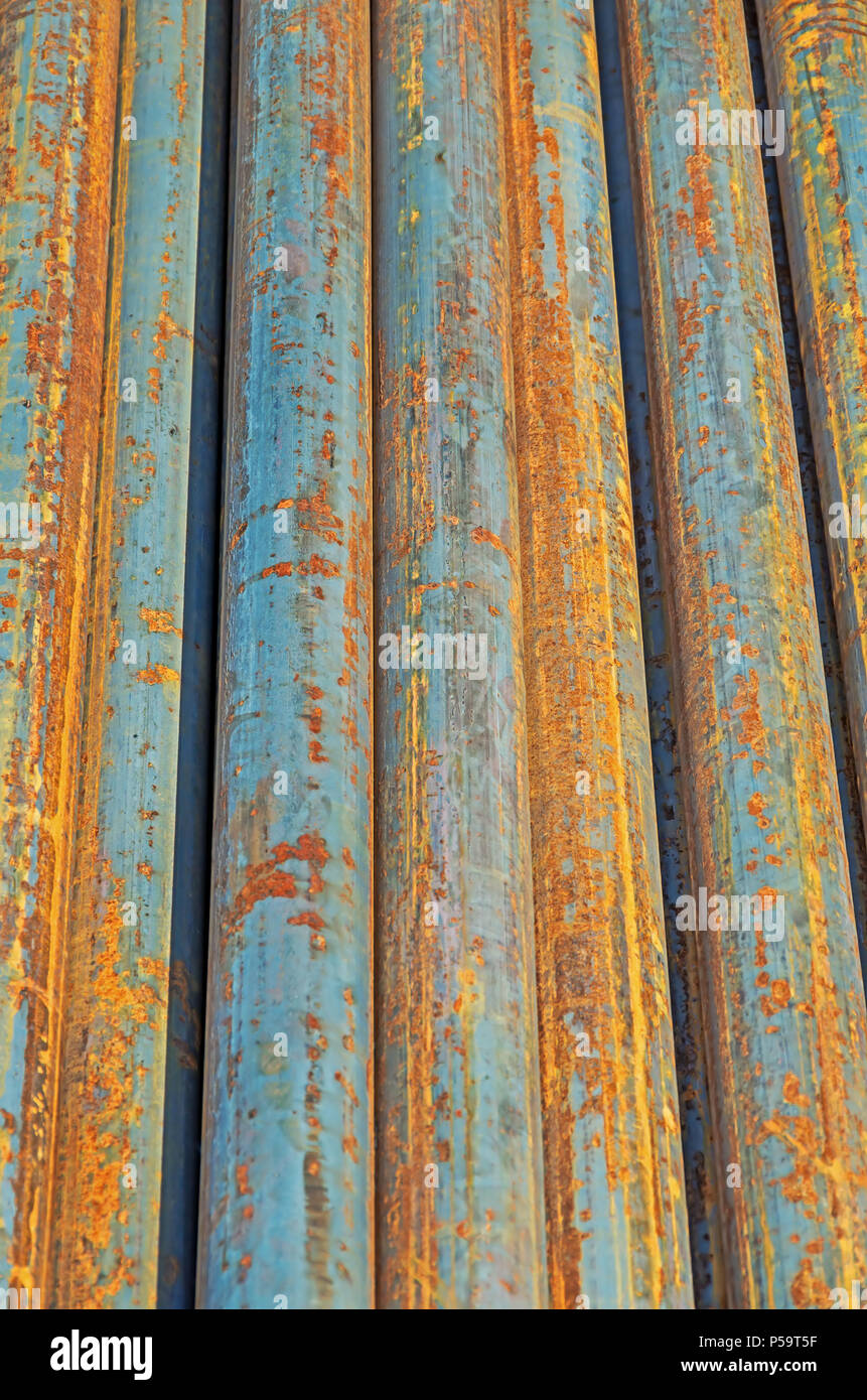 The rusty hot-rolled round steel bars in packs at the warehouse of ...