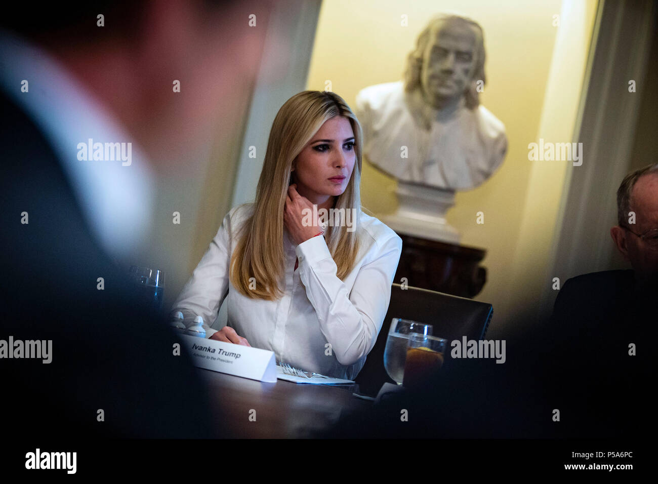 Ivanka Trump, assistant to U.S. President Donald Trump, listens during ...