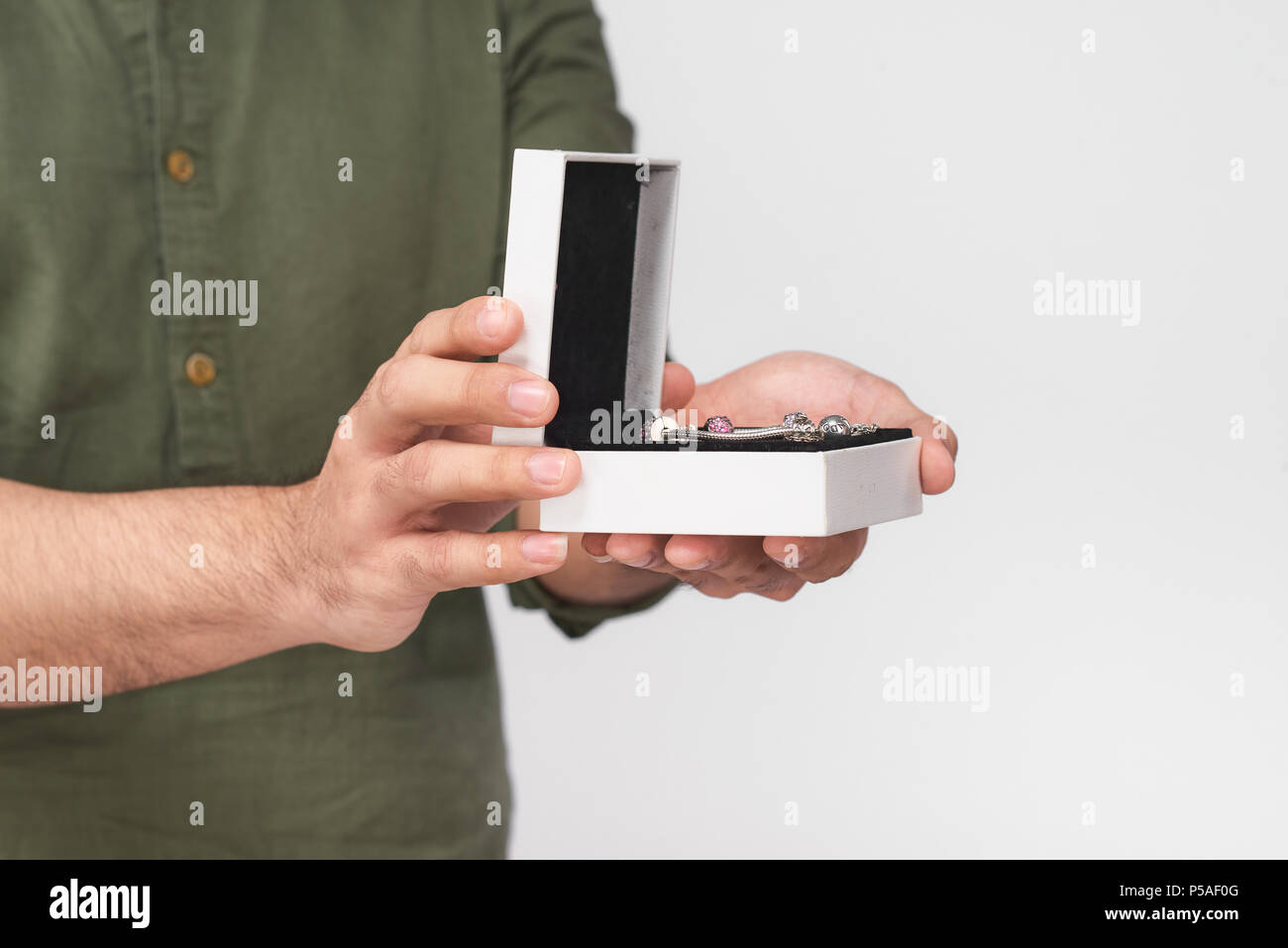 Male hands gives jewelry in a box Stock Photo - Alamy