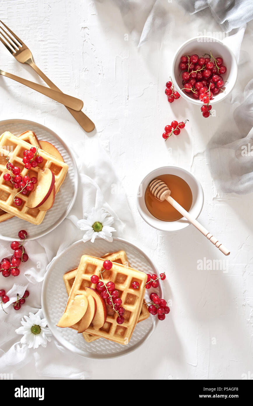 Flat lay of traditional belgian waffles with fresh fruit, nectarine ...