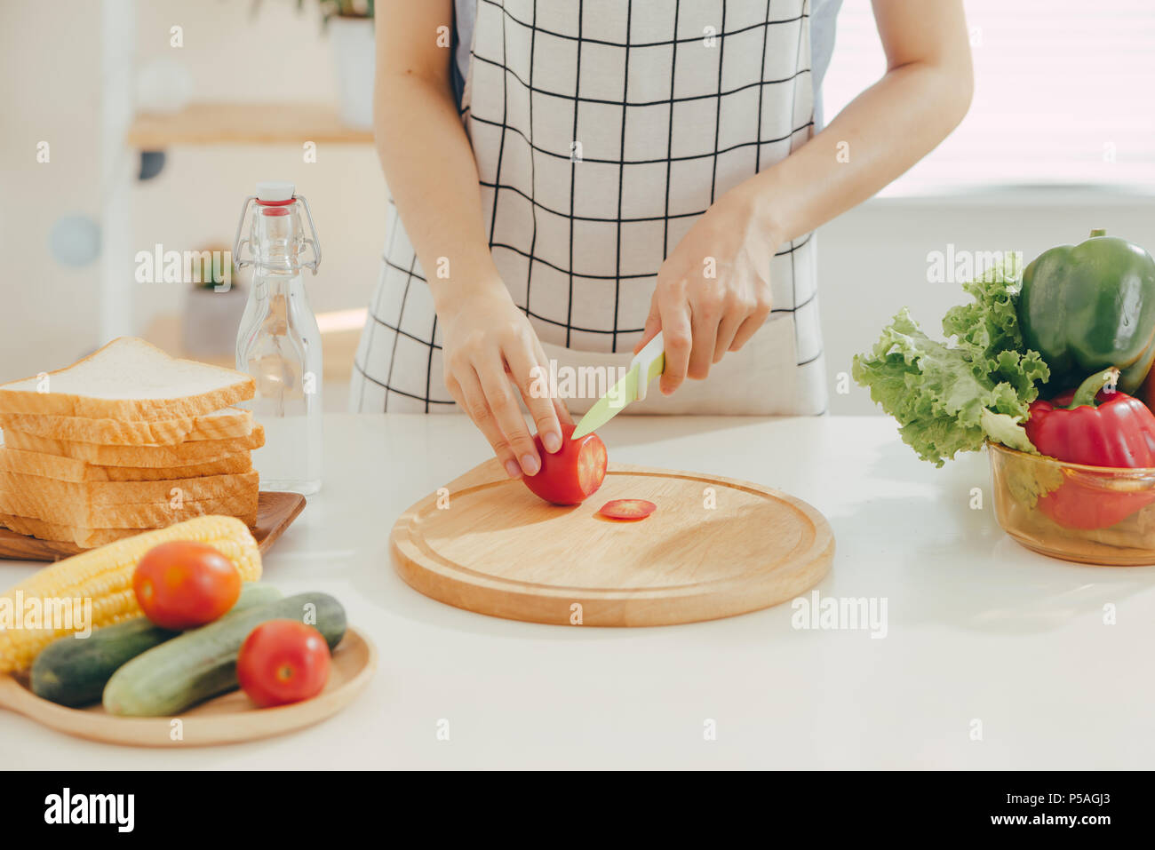 Woman child cutting vegetables hi-res stock photography and images - Alamy