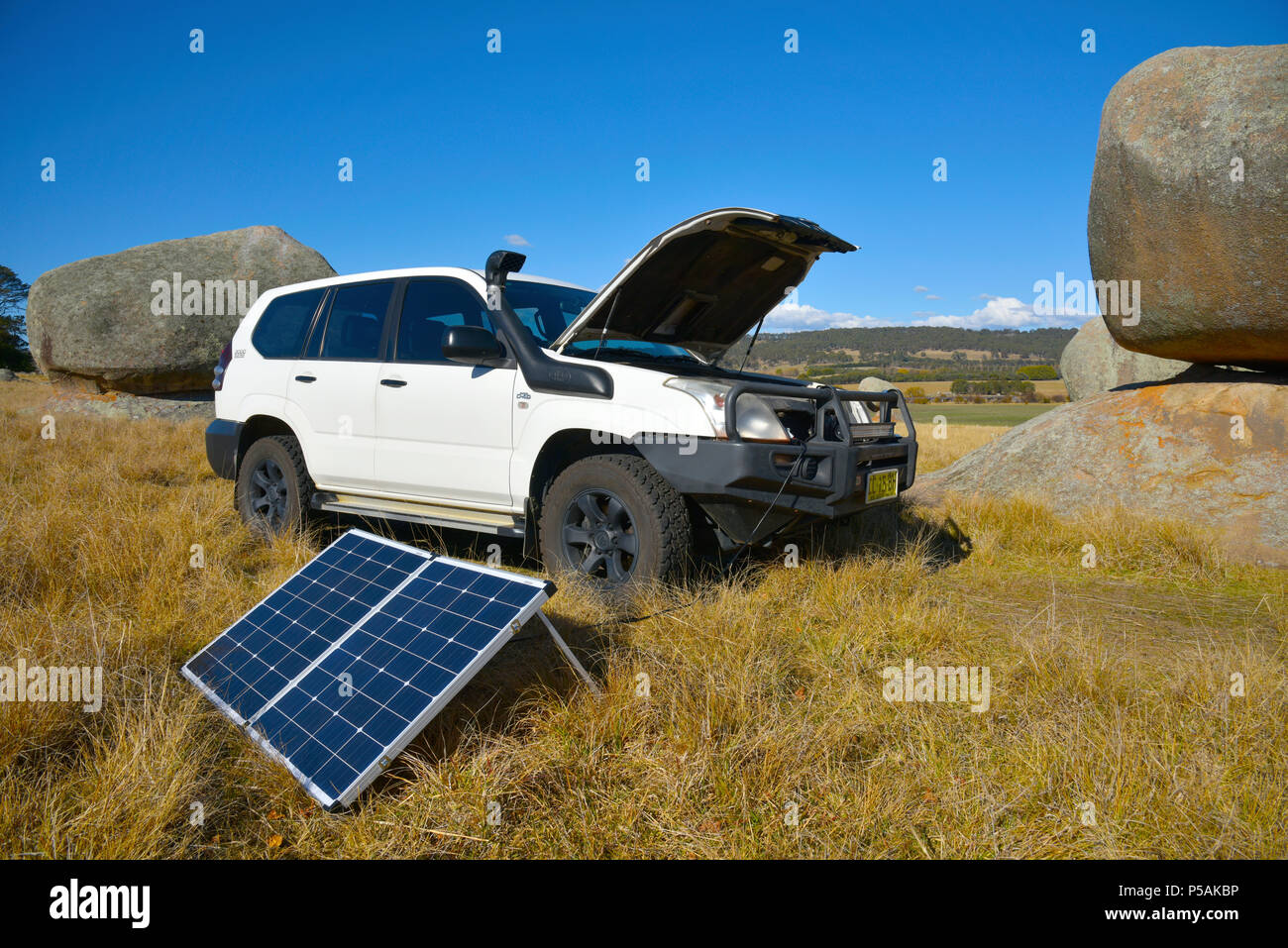 white toyota landcruiser prado 120 series with portable solar panels ...