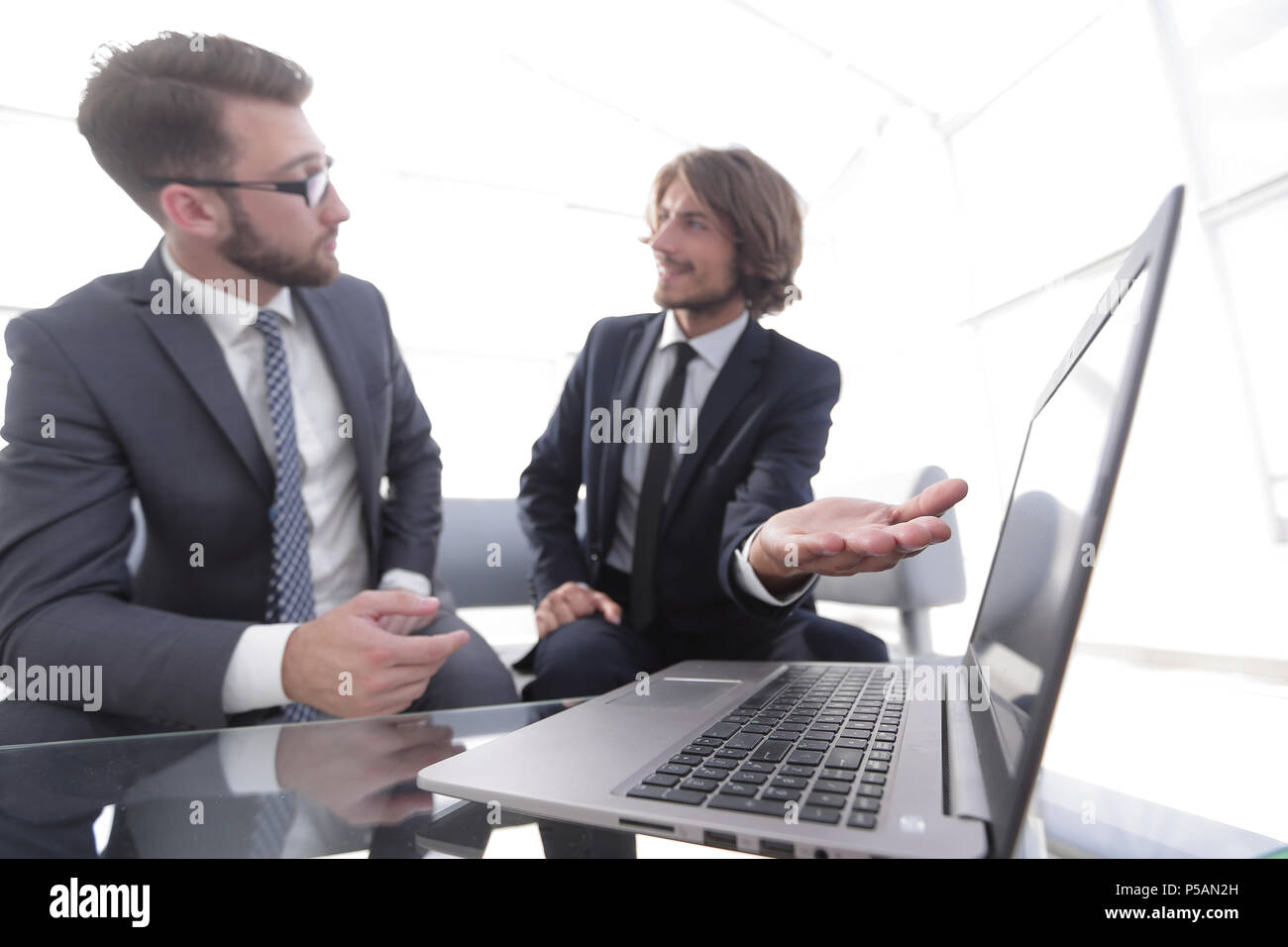 Two businessmen working on a project together Stock Photo - Alamy