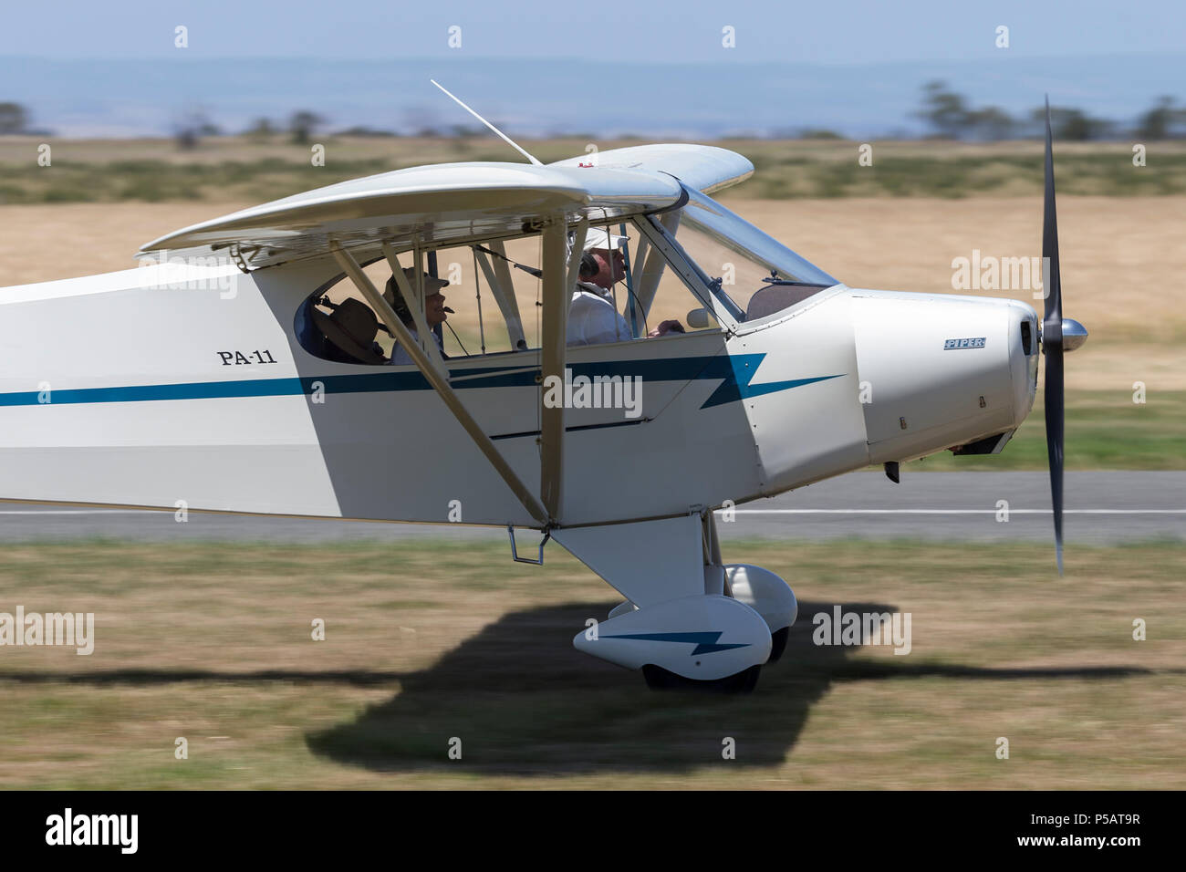 Piper PA-11 Cub Special single engine light aircraft taking off from a ...
