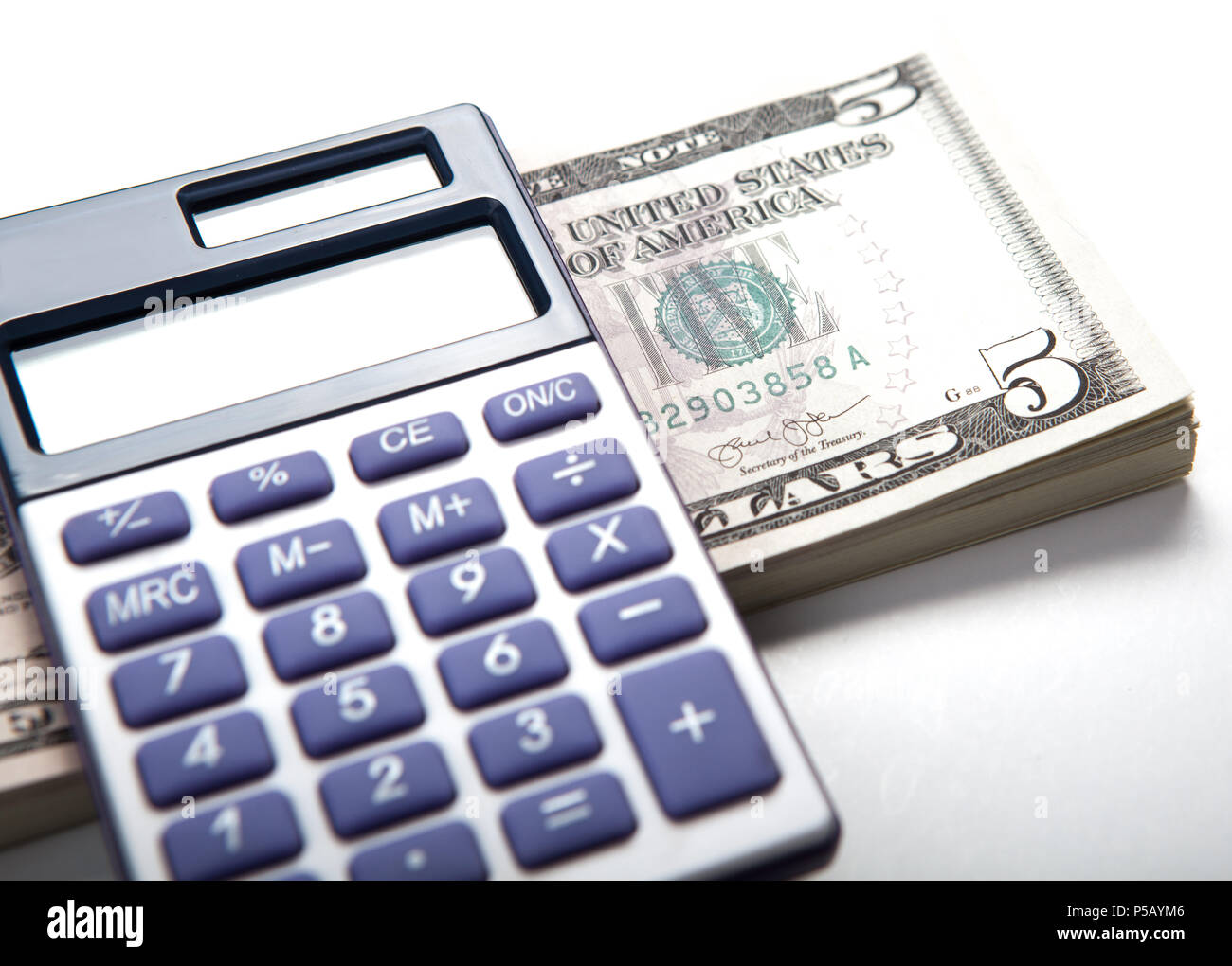 dollars and calculator work close up Stock Photo - Alamy