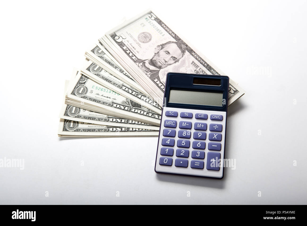 dollars and calculator work close up Stock Photo - Alamy
