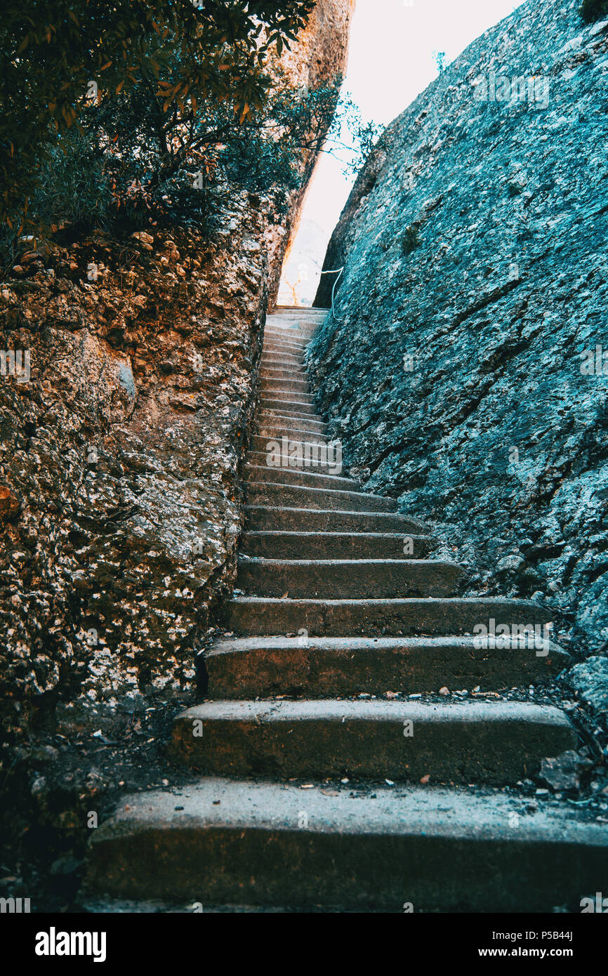 Climbing stairs with two large stones on the sides in the Montserrat ...