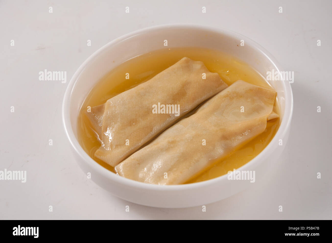 Tofu Skin Rolls with Minced Pork in Chicken soup Stock Photo - Alamy