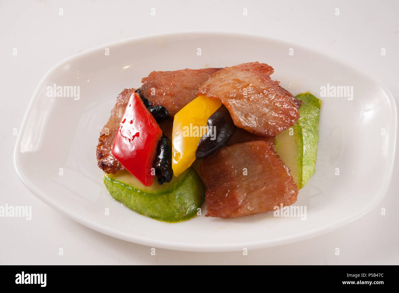 fried barbecued pork with melon Stock Photo - Alamy