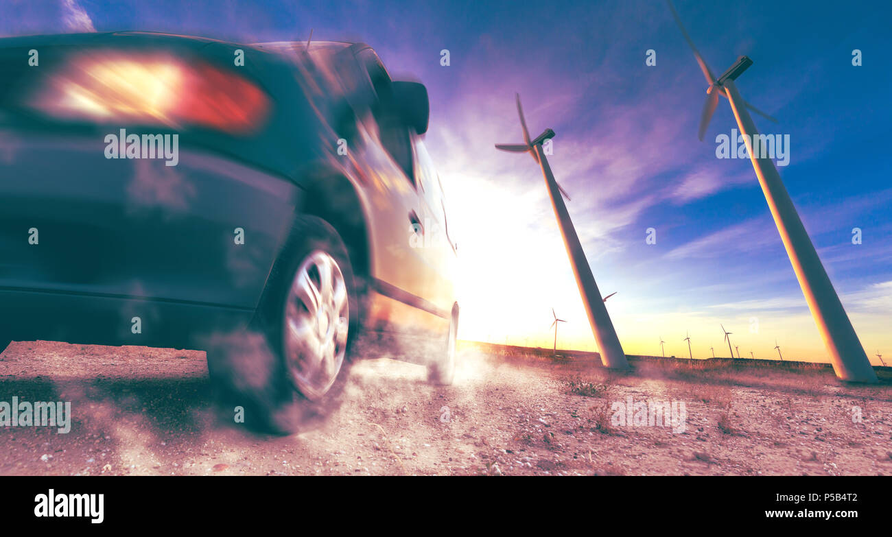 Wind mills and tire car detail.Electricity and ecology Stock Photo - Alamy