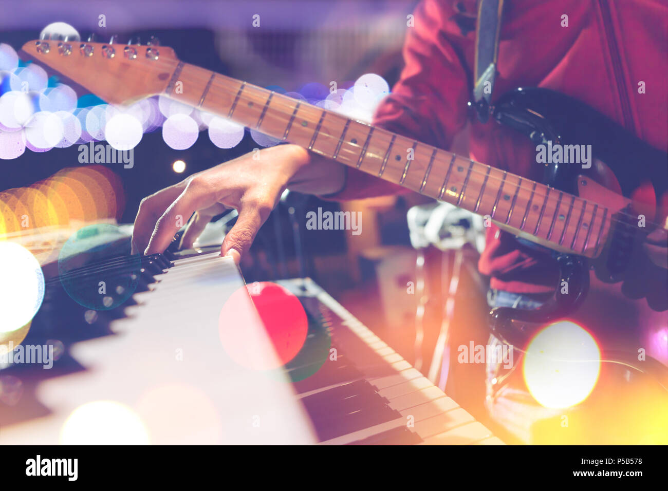 Guitar and piano keyboard detail.Live music and concert background ...