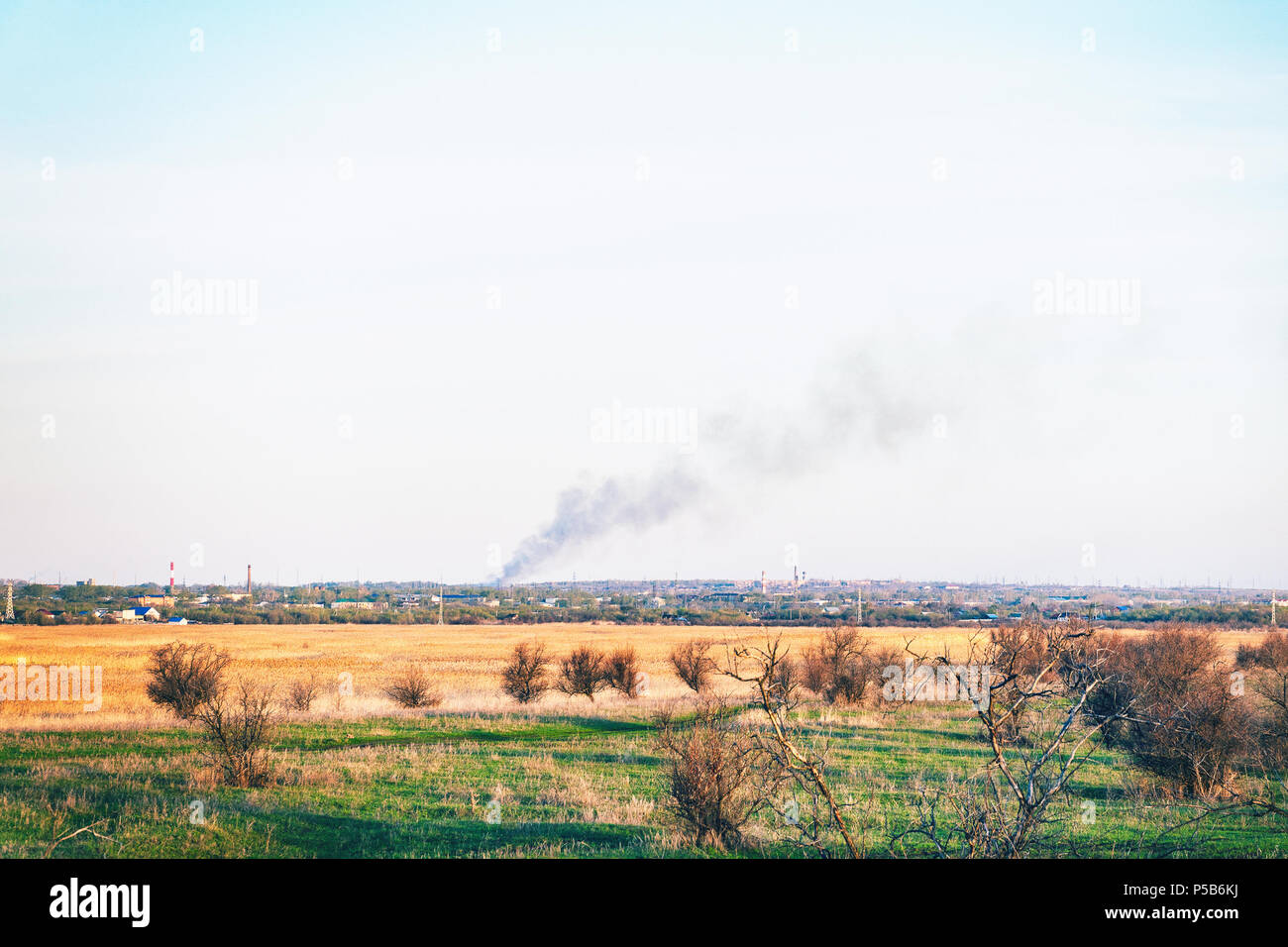 Smoke from a fire in distance Stock Photo - Alamy