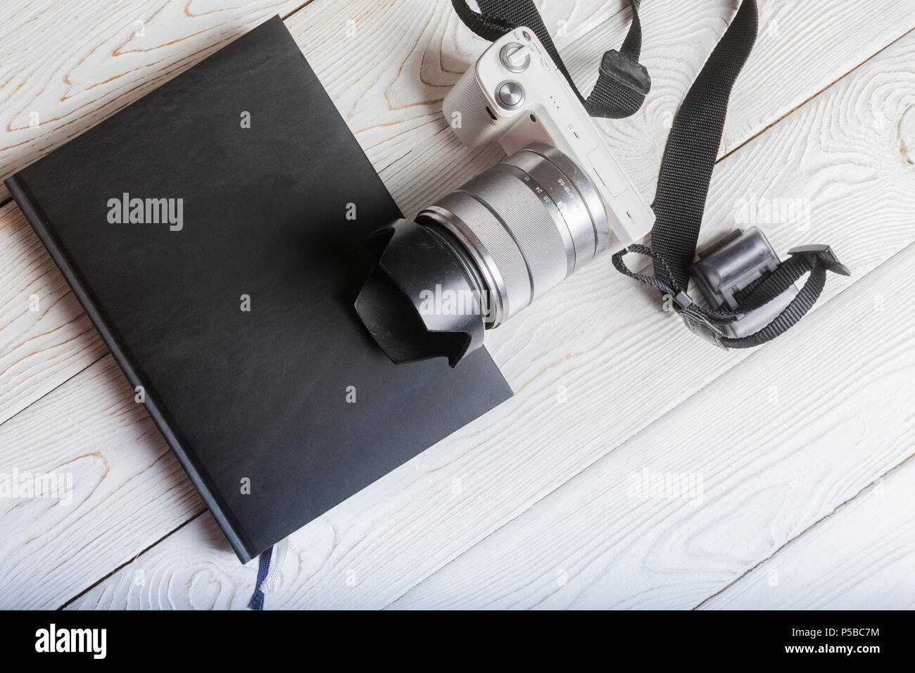 Photo camera on office table with notepad hi-res stock photography and ...
