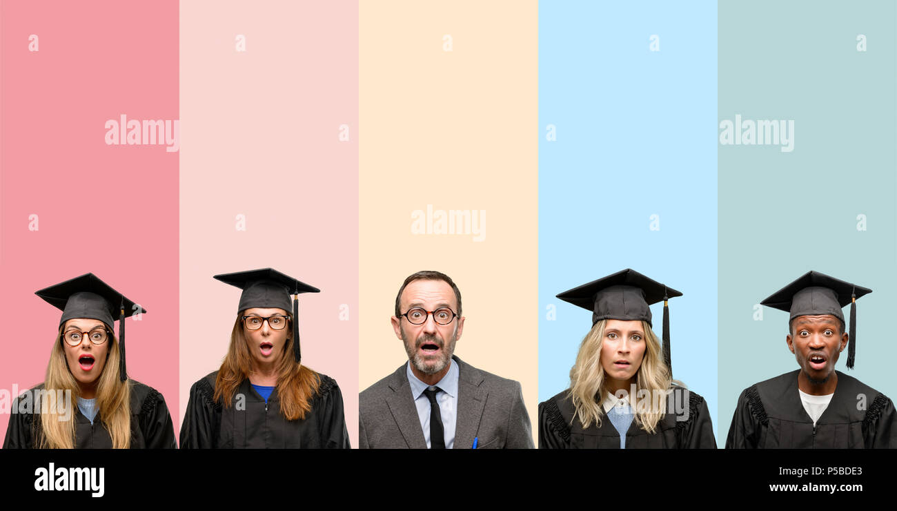 Senior teacher with his graduate students scared in shock, expressing ...