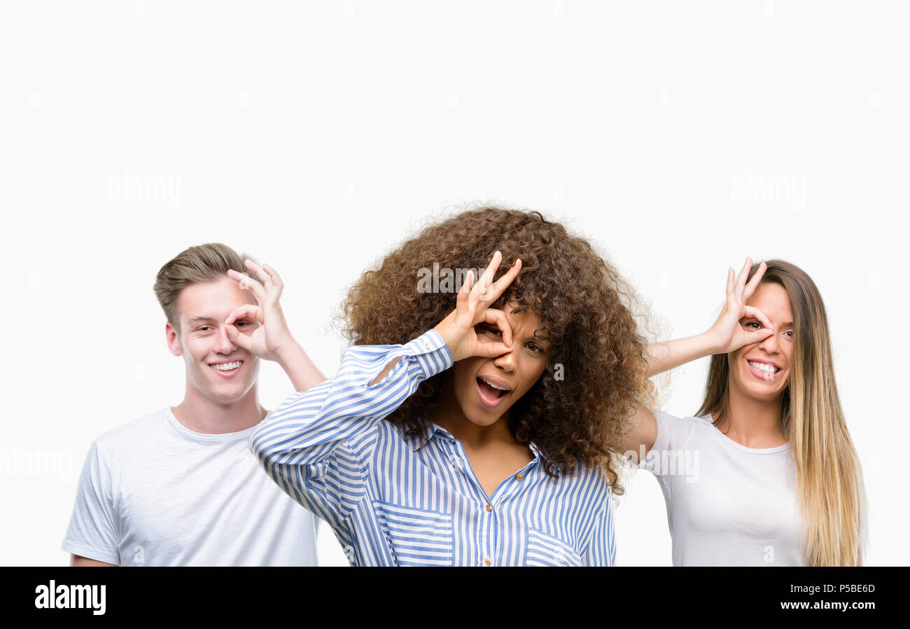 Group of young people over white background with happy face smiling ...