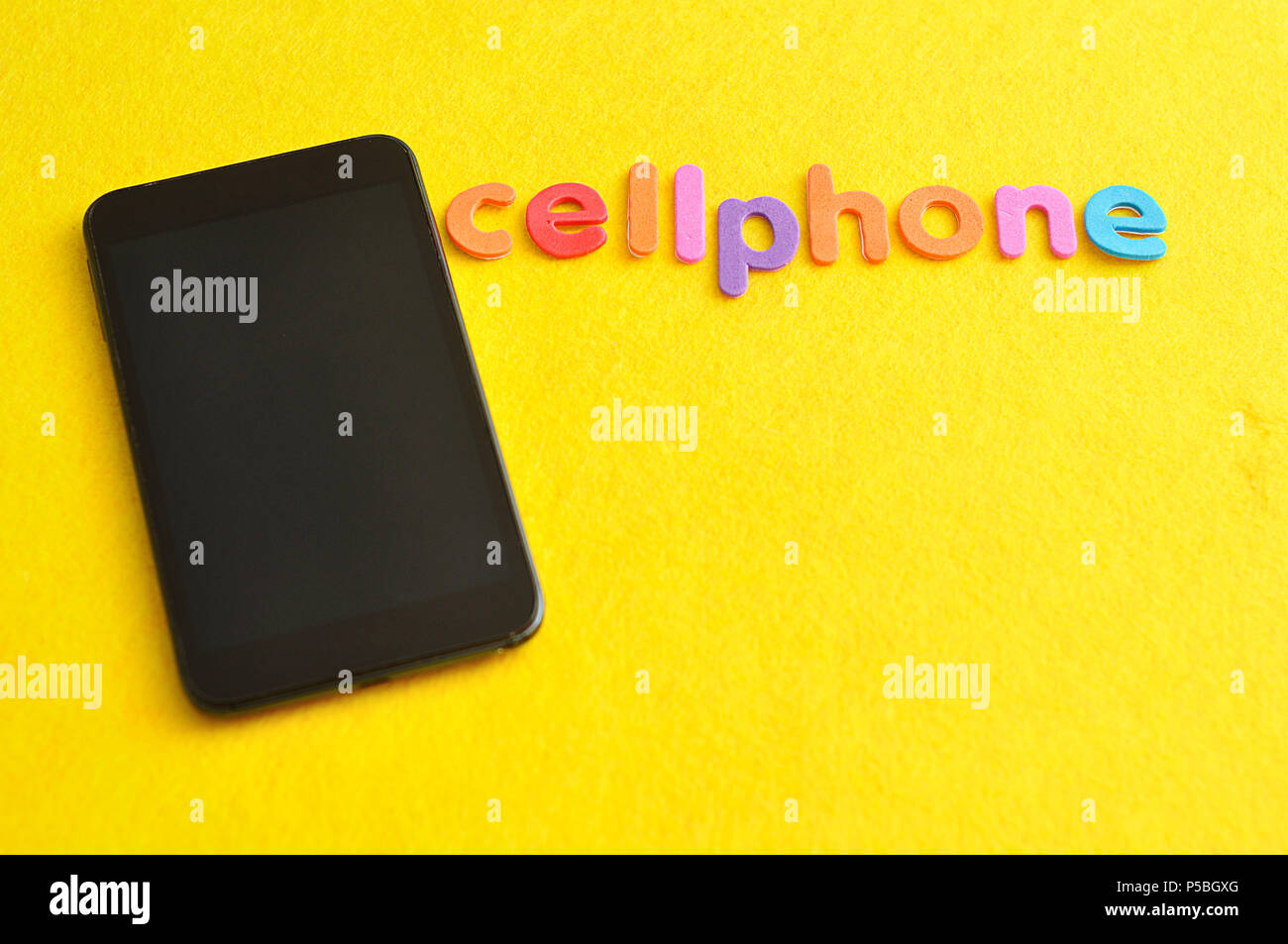 The word cellphone displayed with a cellphone on a yellow background ...