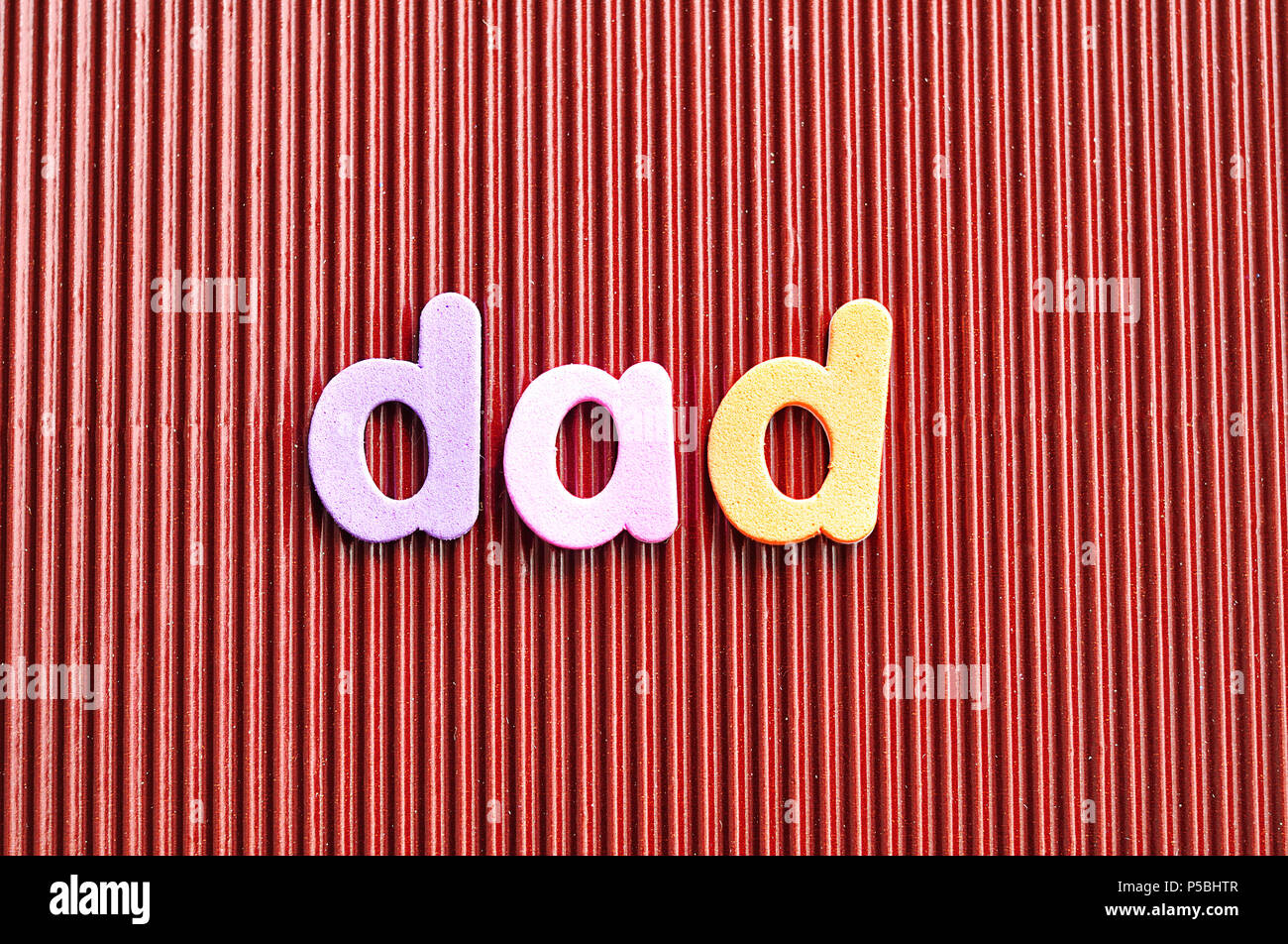 The word dad on a brown background Stock Photo - Alamy