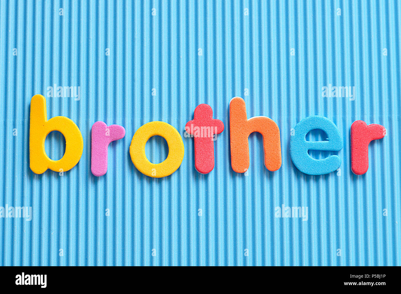 The word brother on a blue background Stock Photo - Alamy