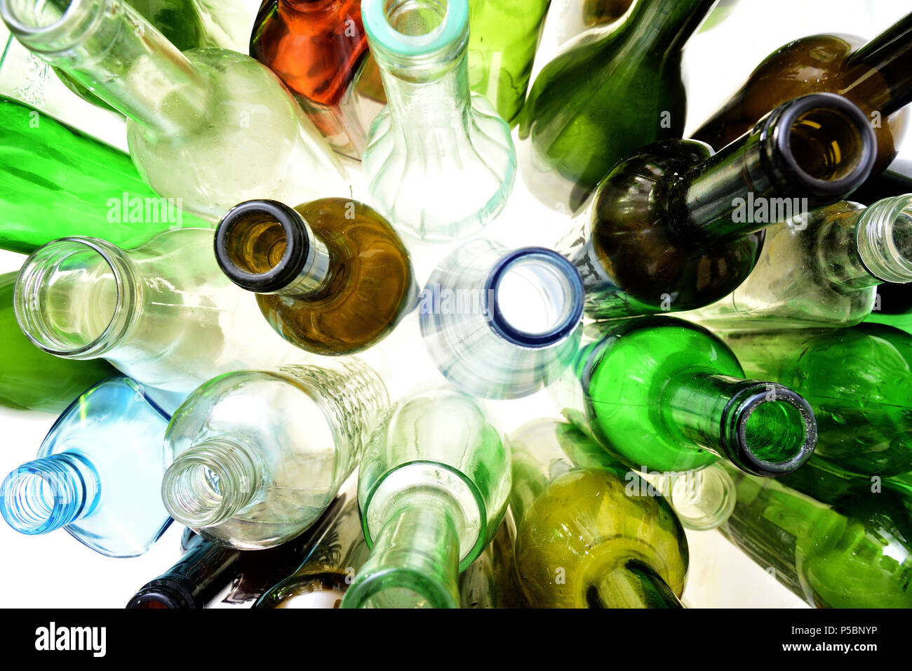top view of glass bottles on white Stock Photo - Alamy