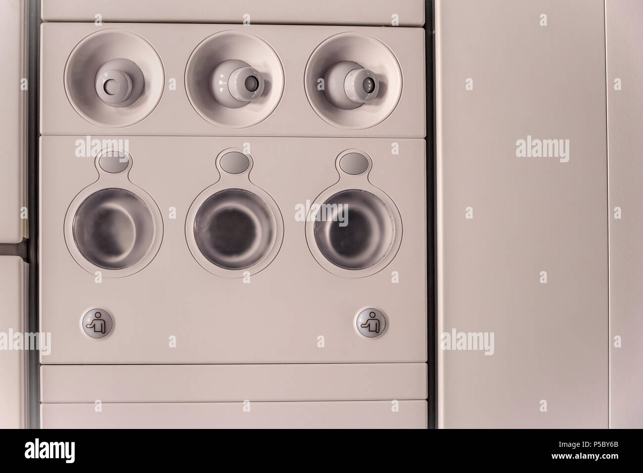 airplane cabin interior detail. Overhead console in the modern ...