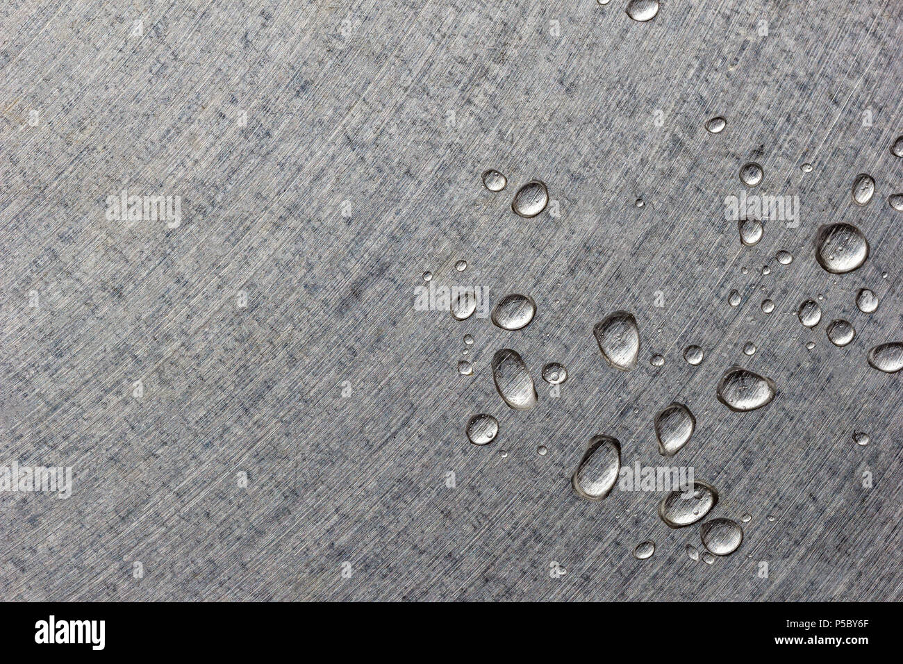 Some water drops in a corner on the metallic grey surface Stock Photo ...