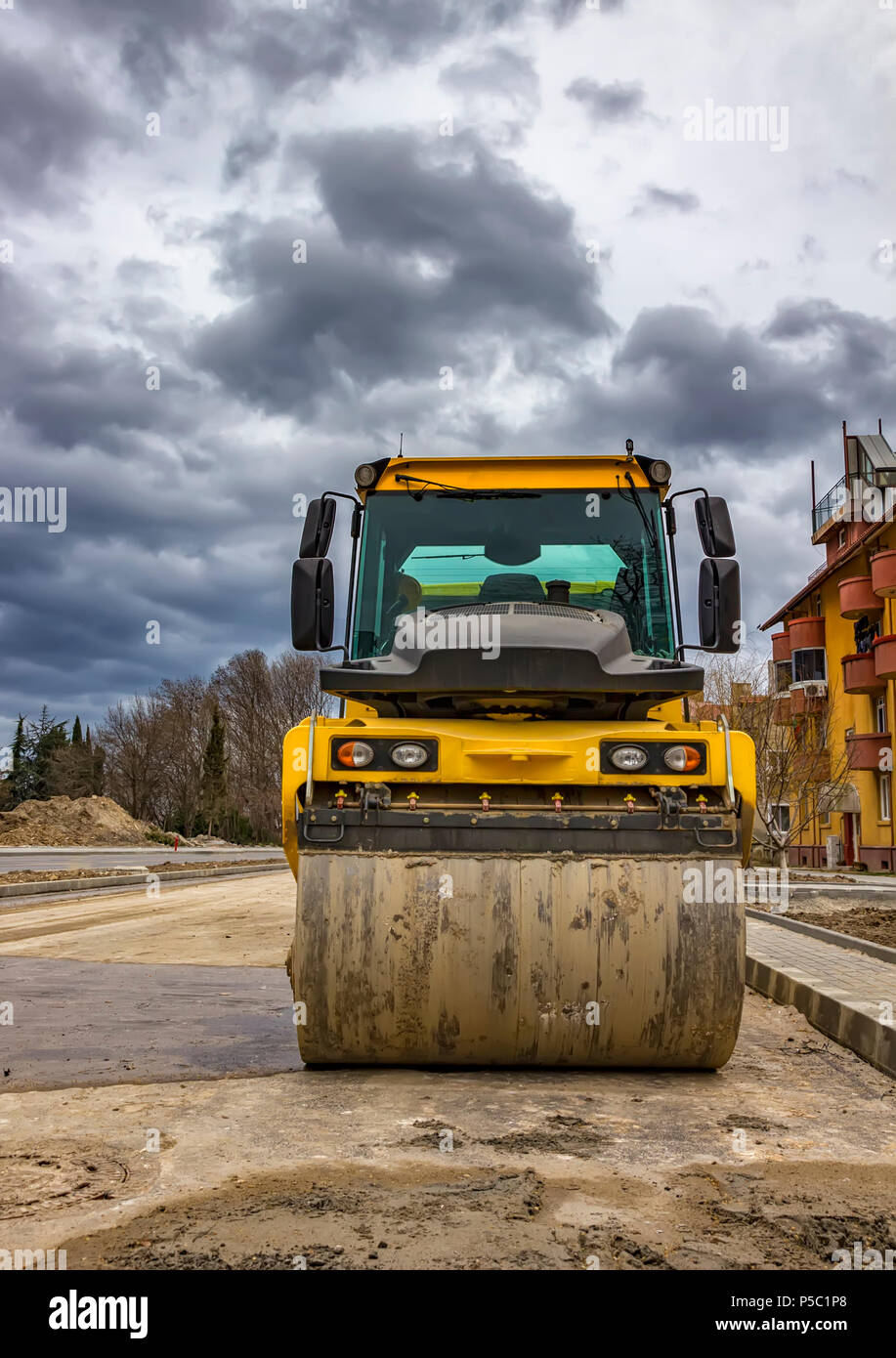 Stopped drum roller at the construction site. Front view Stock Photo ...
