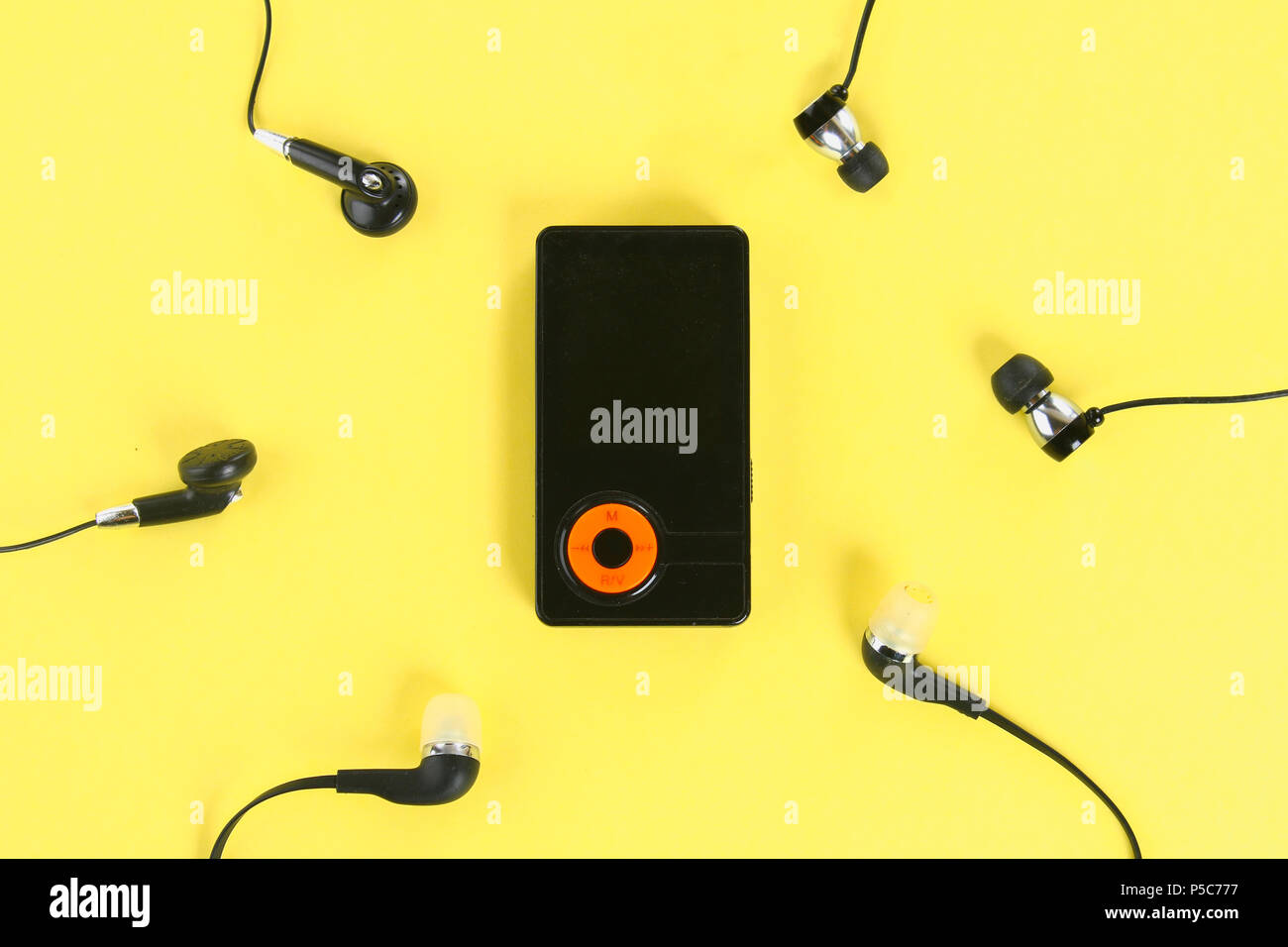 MP3 Player with Headphones on pastel yellow background. Minimalism ...