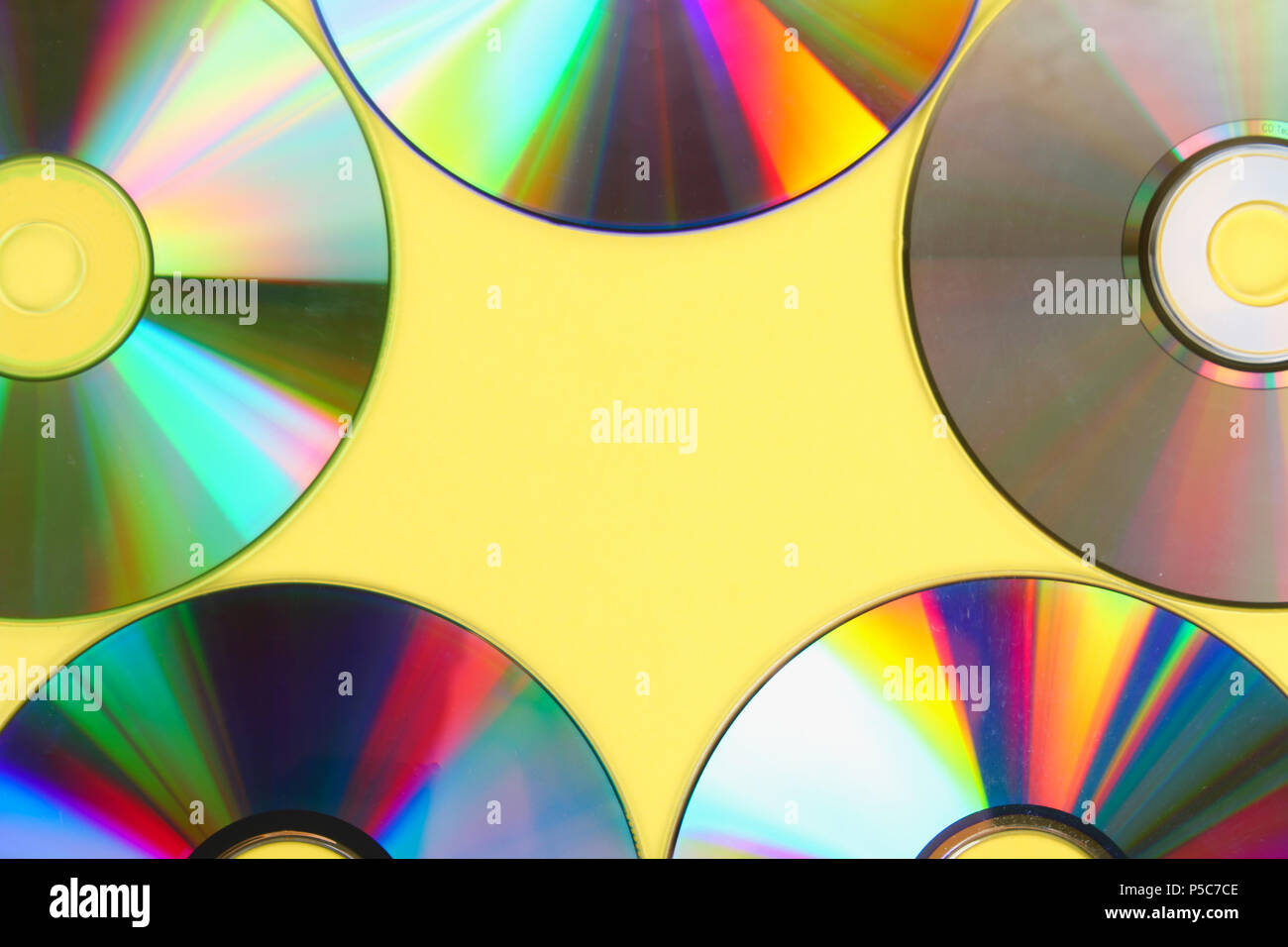 Piles of old and dirty CDs,DVD on pastel background. Used and dusty ...