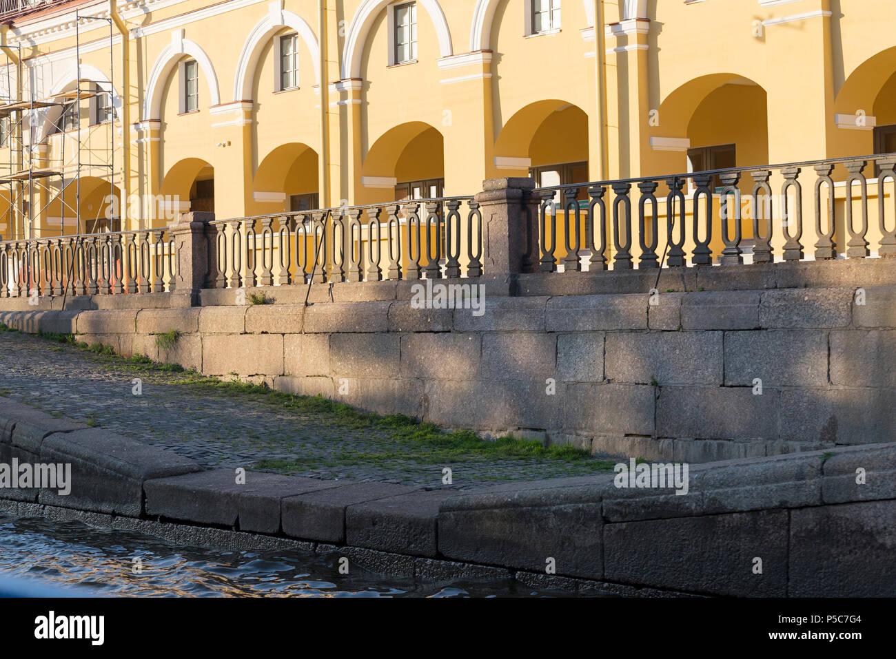 Old yellow building of St. Petersburg near the river Stock Photo - Alamy